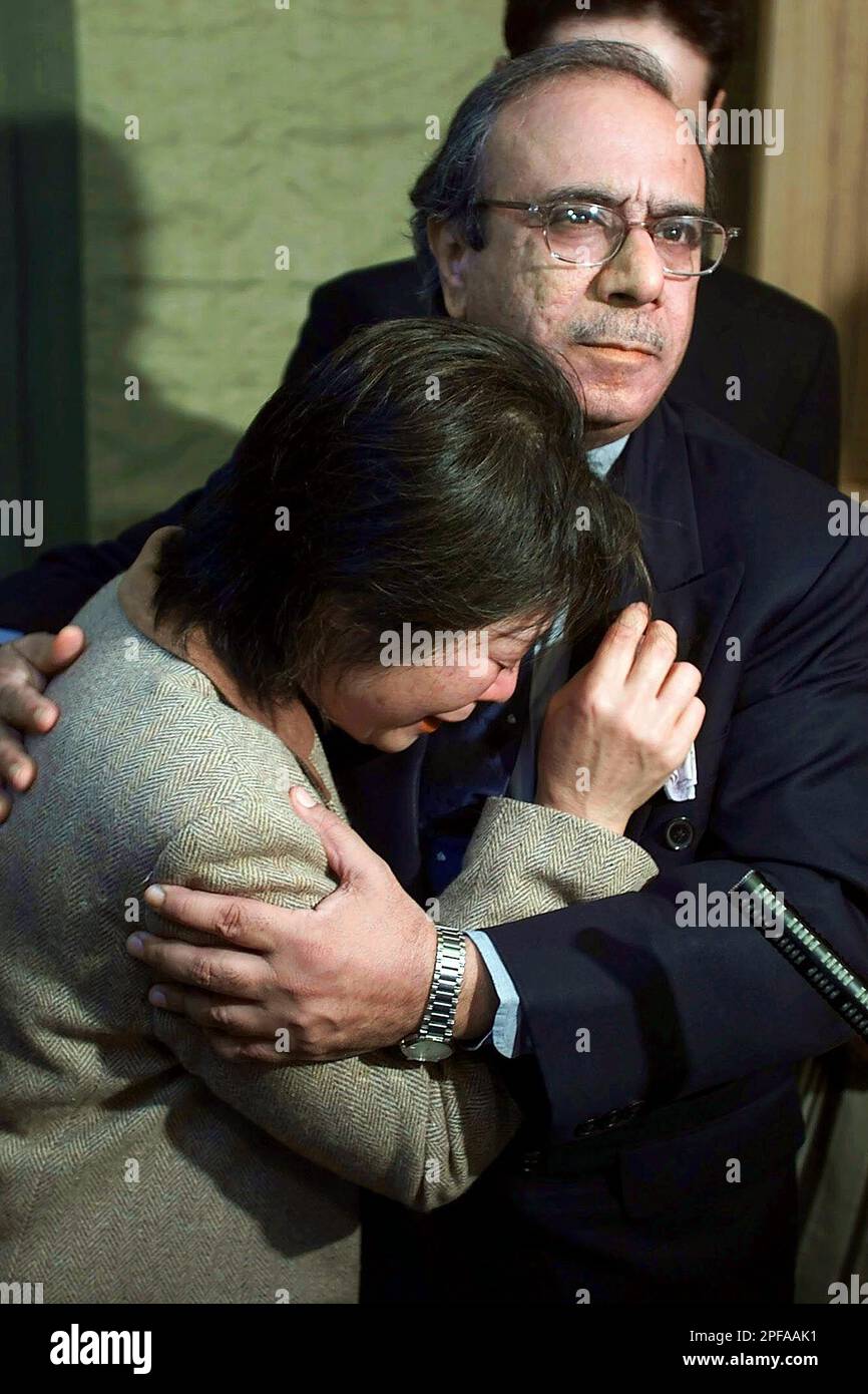 Keiko Takeuchi, left, mother of Taro Takeuchi, an employee of Japanese ...
