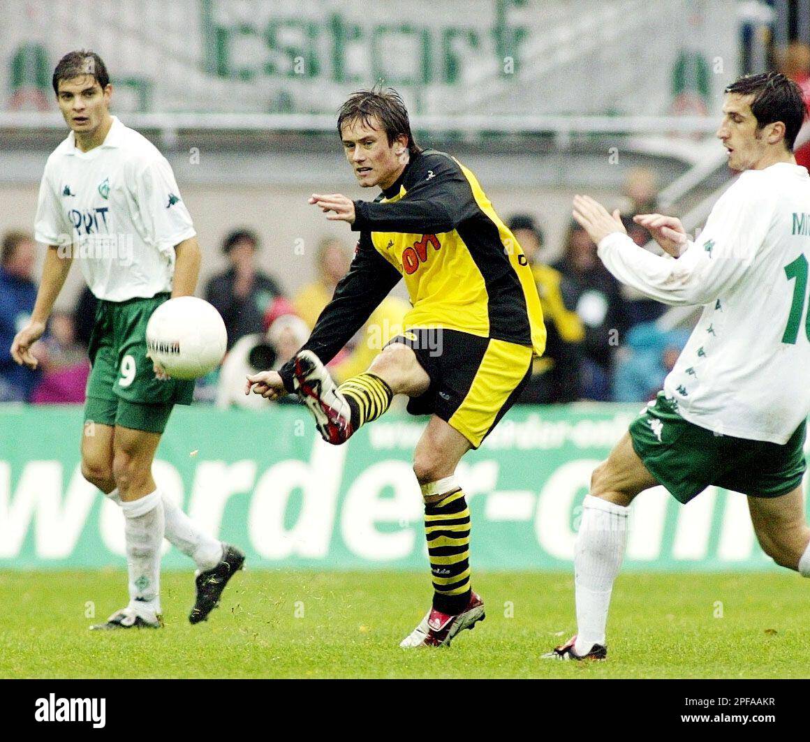 Dortmund's Czech player Tomas Rosicky, centre, crosses the ball during ...