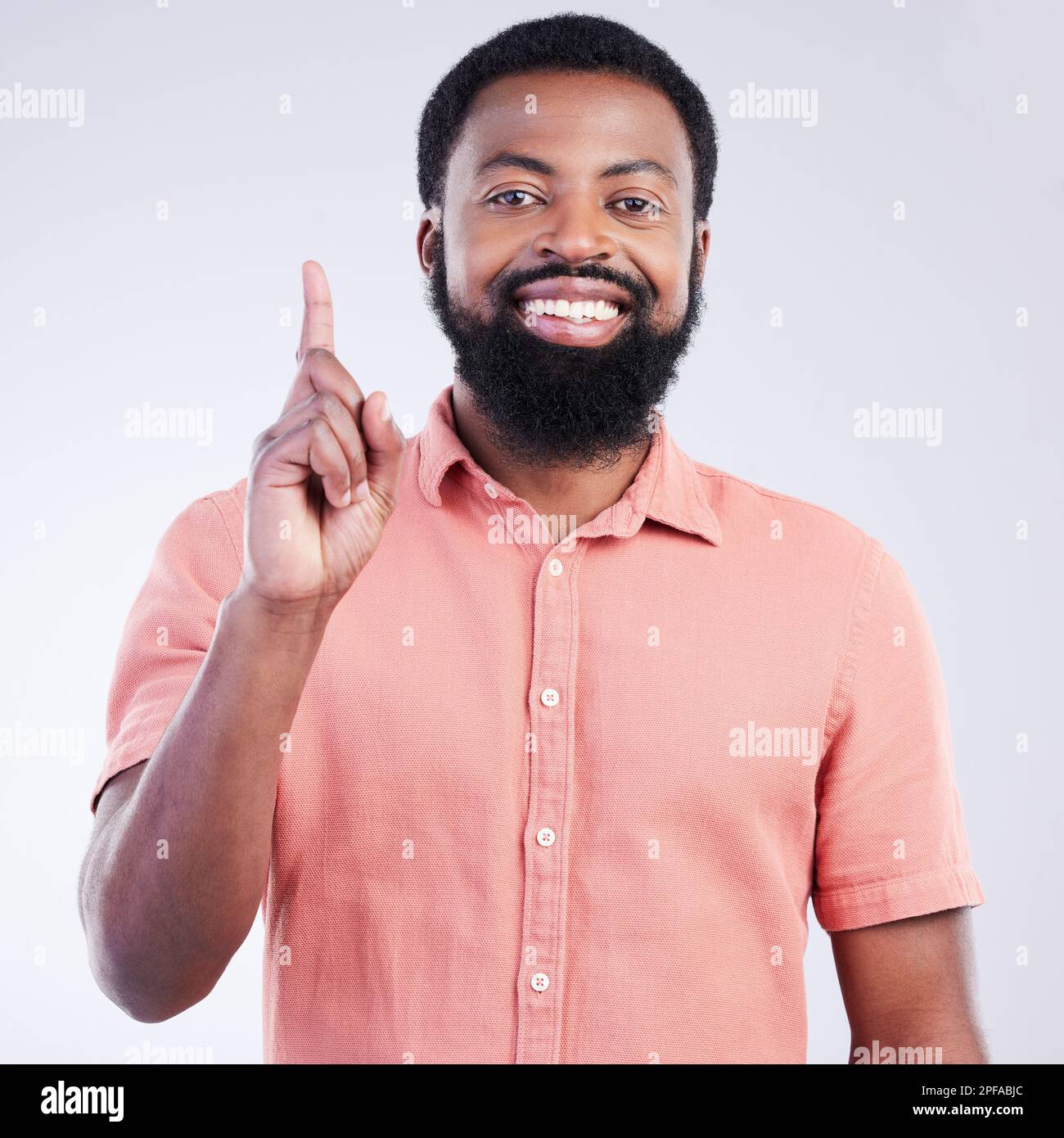 Black man, studio portrait and point finger for answer, question and ...
