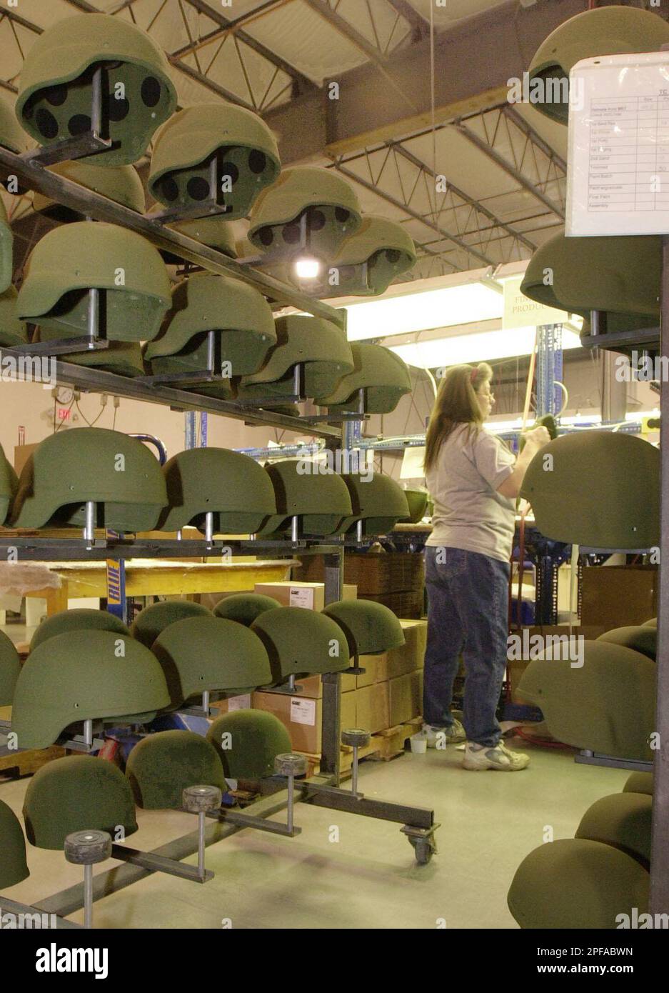 A rack of military helmets awaits final preparation at the MSA Gallet ...