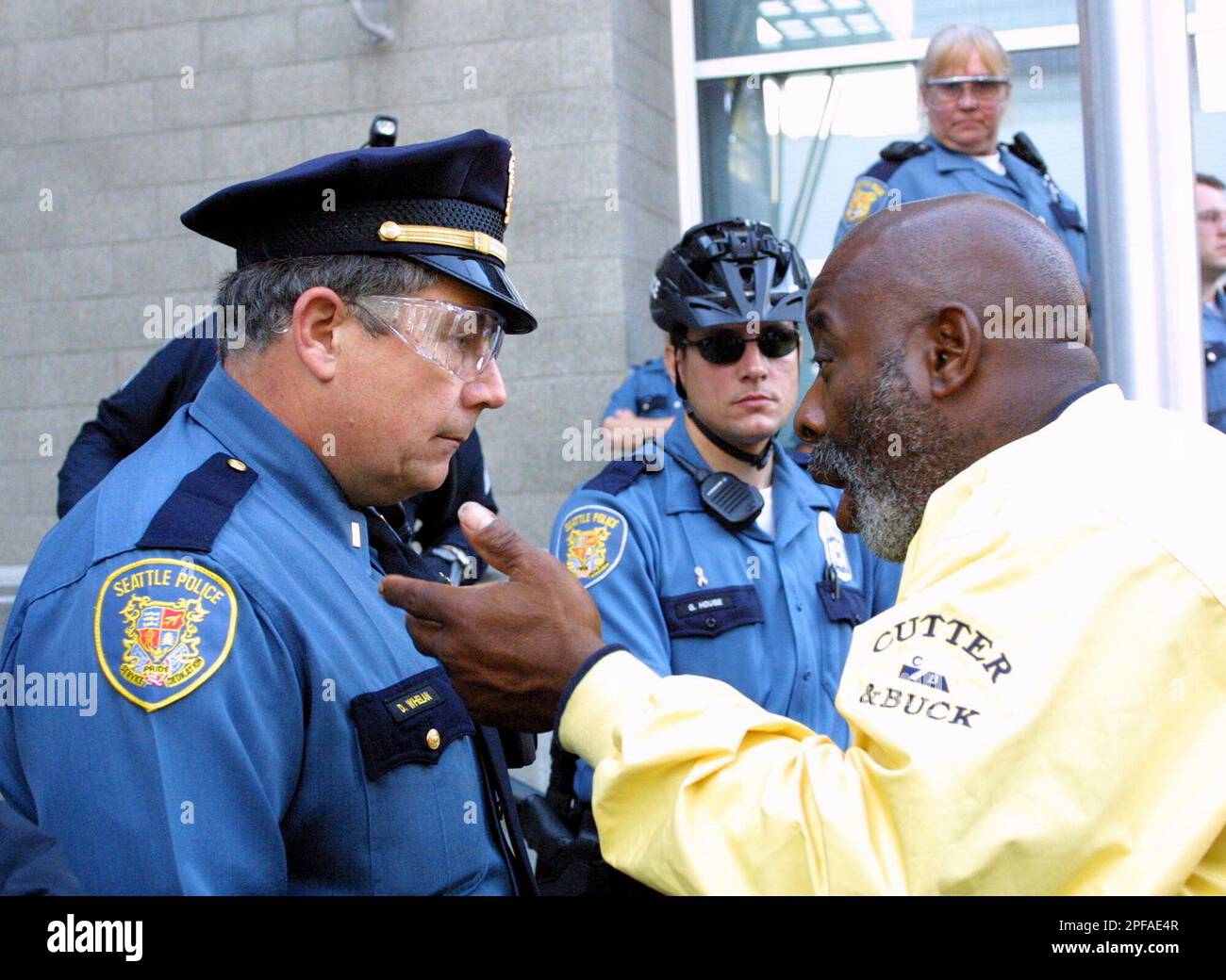 David Barfield, right, talks with a police officer at a police station ...