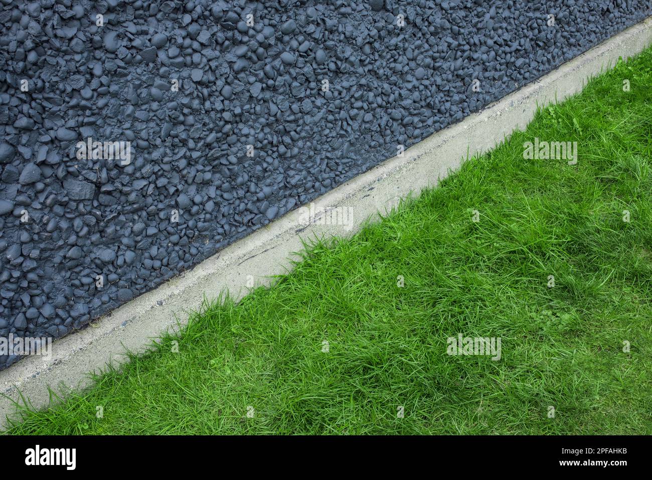 Dark textured wall and green grass background. Green grass background ...