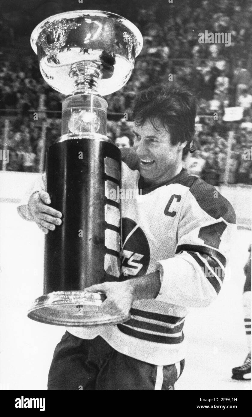 Winnipeg Jets captain Lars-Erik Sjoberg carries the Avco Cup after the ...