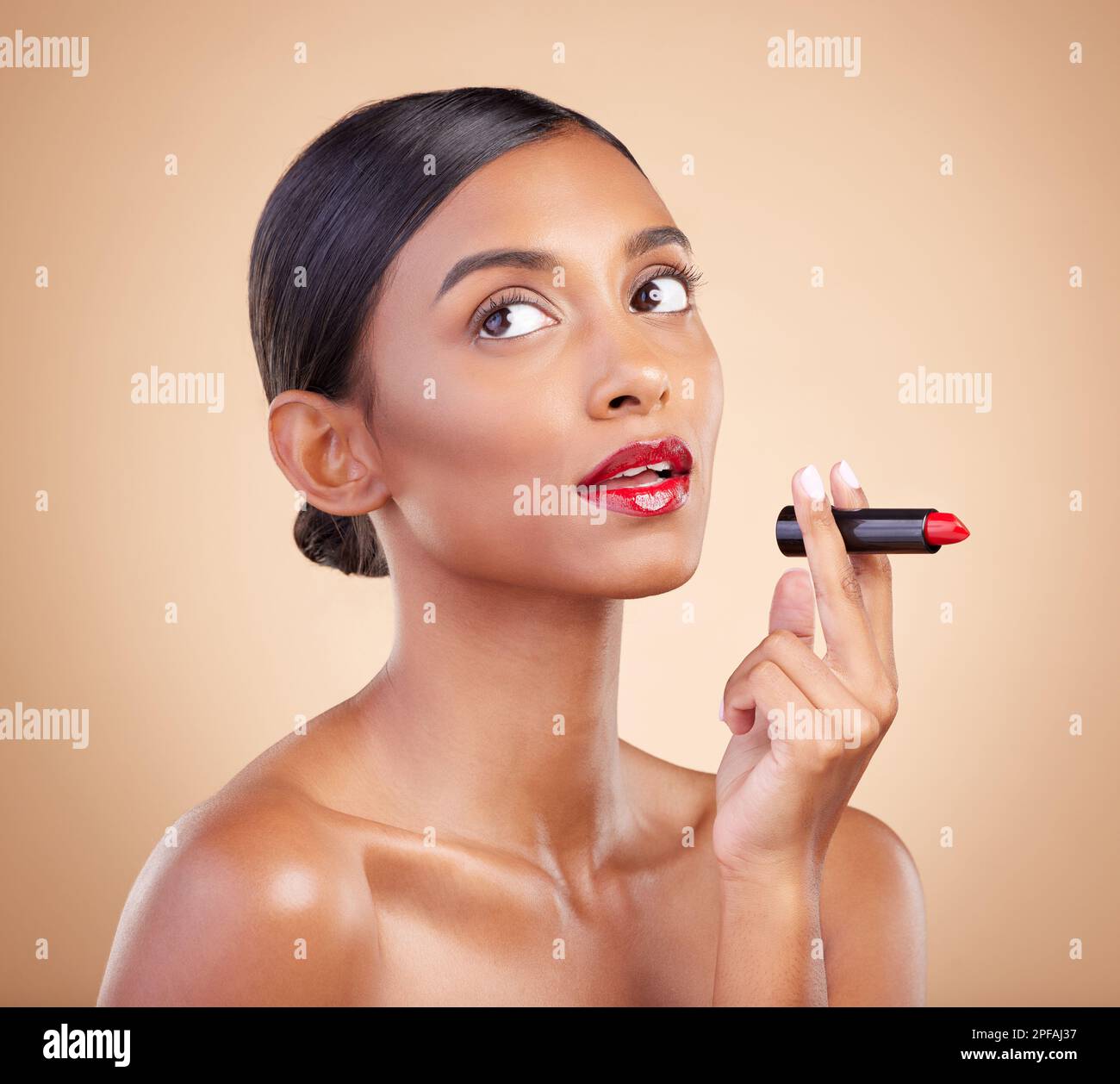 Beauty, red lipstick and makeup on a woman in studio for cosmetics ...