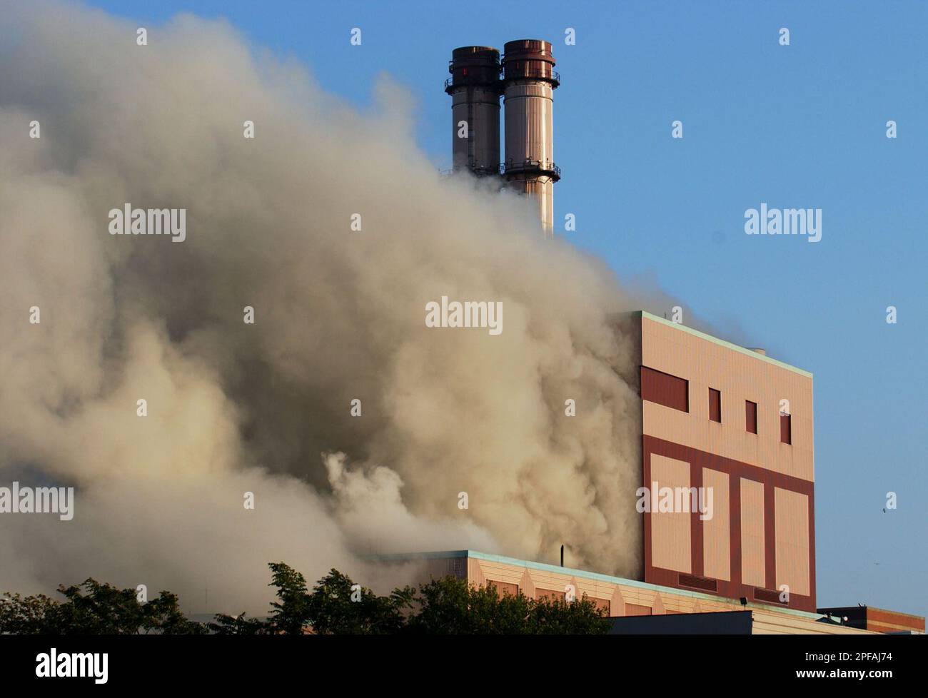 Smoke pours from the Sithe energy power plant in Boston Tuesday, Oct. 1 ...