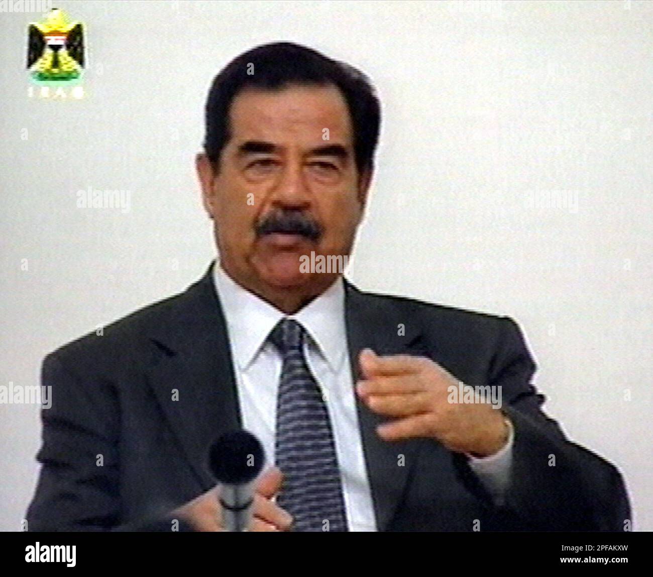 Iraqi President Saddam Hussein speaks at a cabinet meeting in Baghdad ...