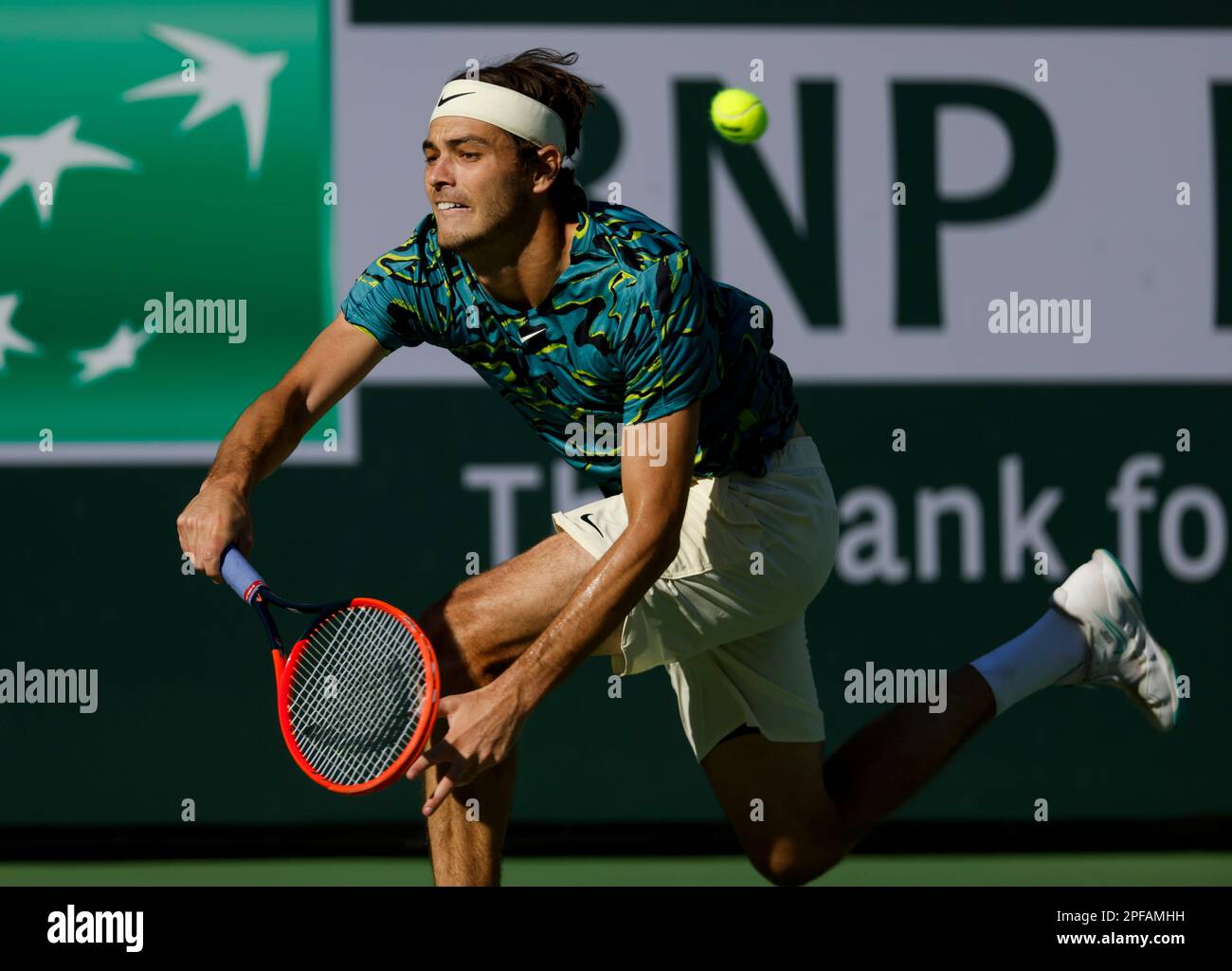 March 16, 2023 Taylor Fritz returns a shot against Jannik Sinner of Italy during the 2023 BNP ...