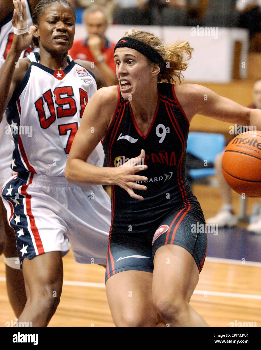 Spain's Amaya Valdemoro Madariaga, (9) drives around USA's Sheryl Denis ...