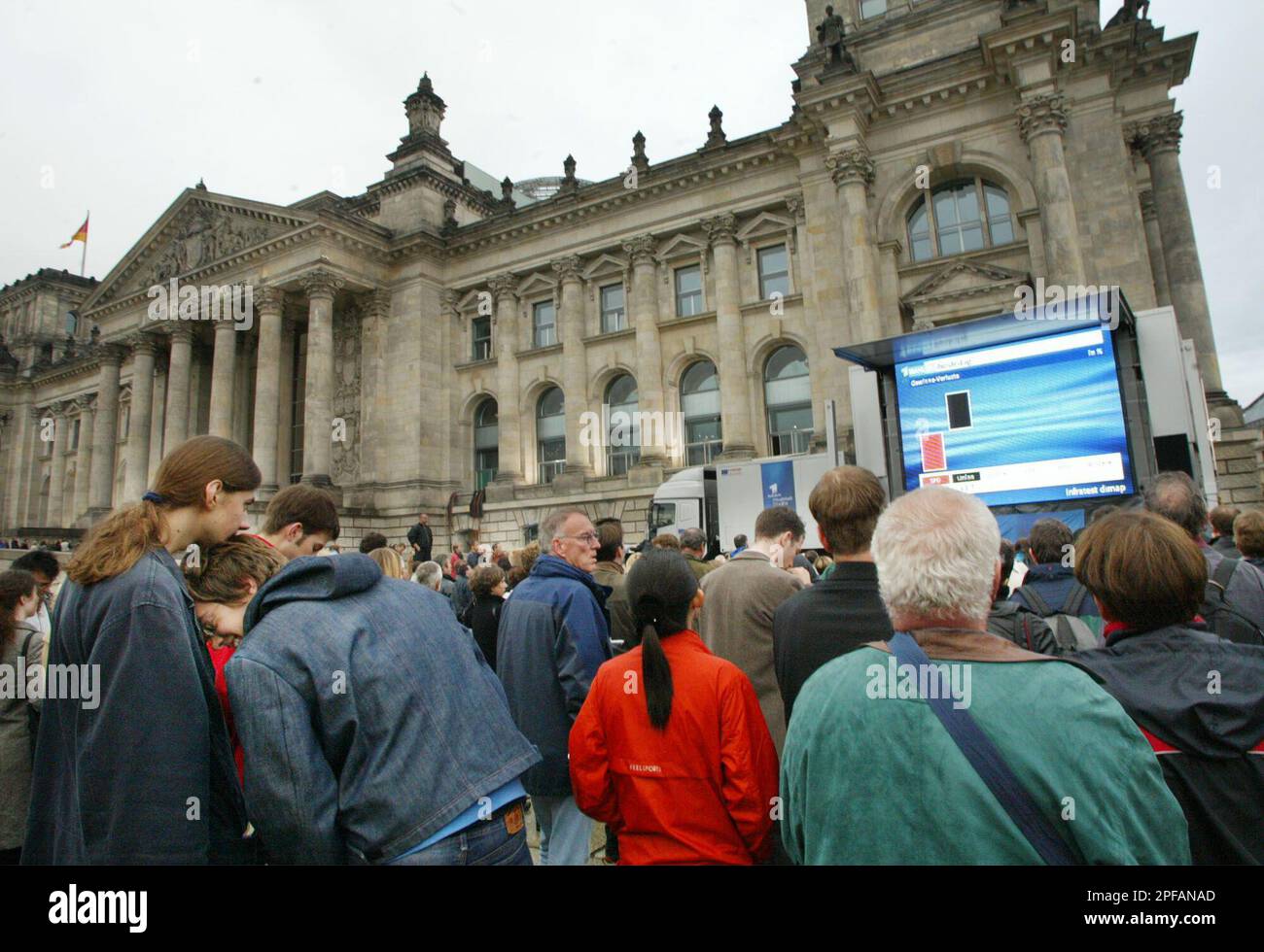 Berliners watch the first election results of the German national ...