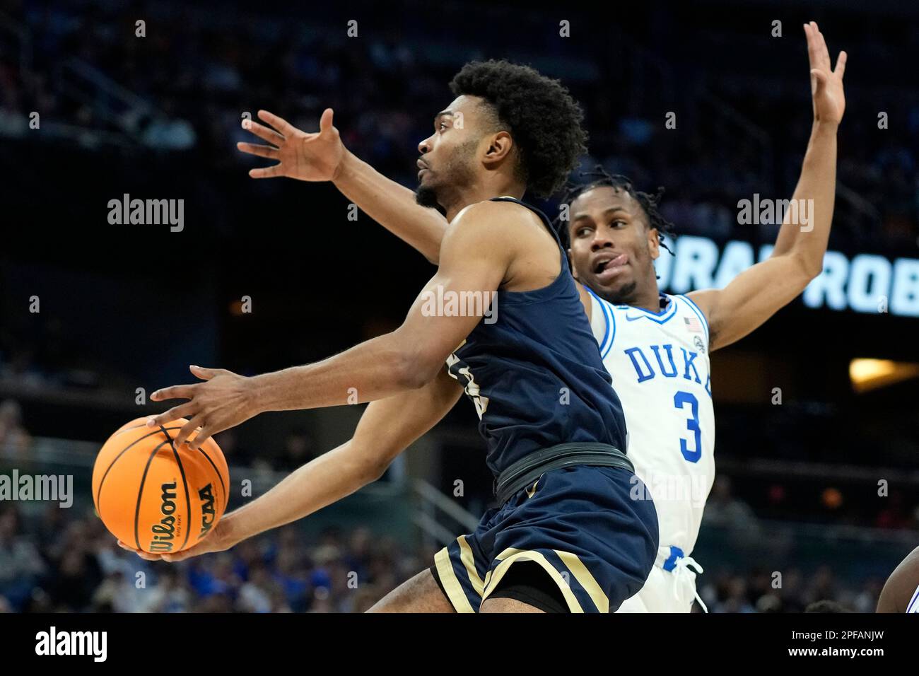 Oral Roberts guard Issac McBride, left, drives around Duke guard Jeremy ...