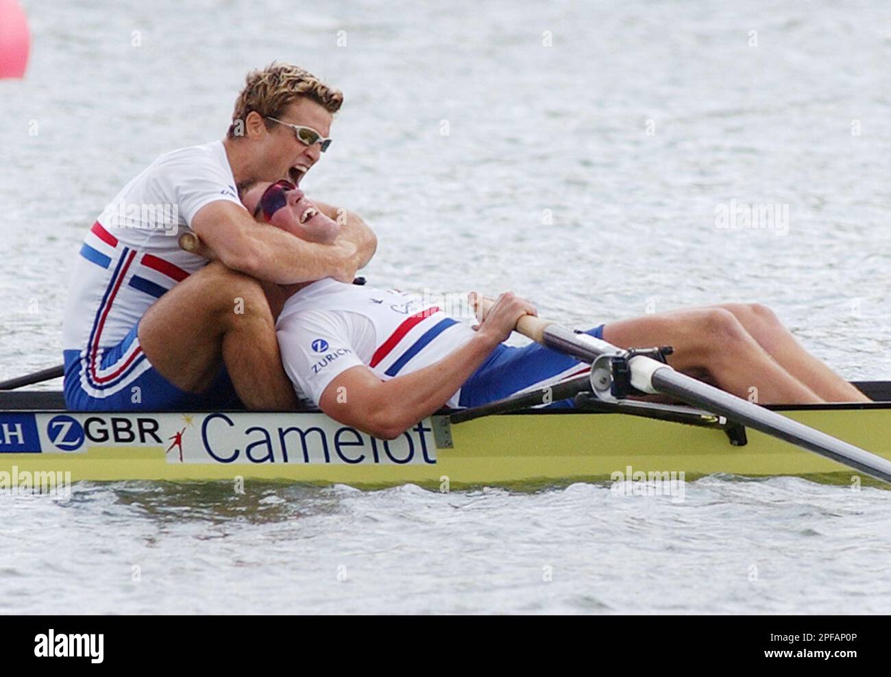 Great Britain's James Cracknell, left, embraces Matthew Pinsent after ...