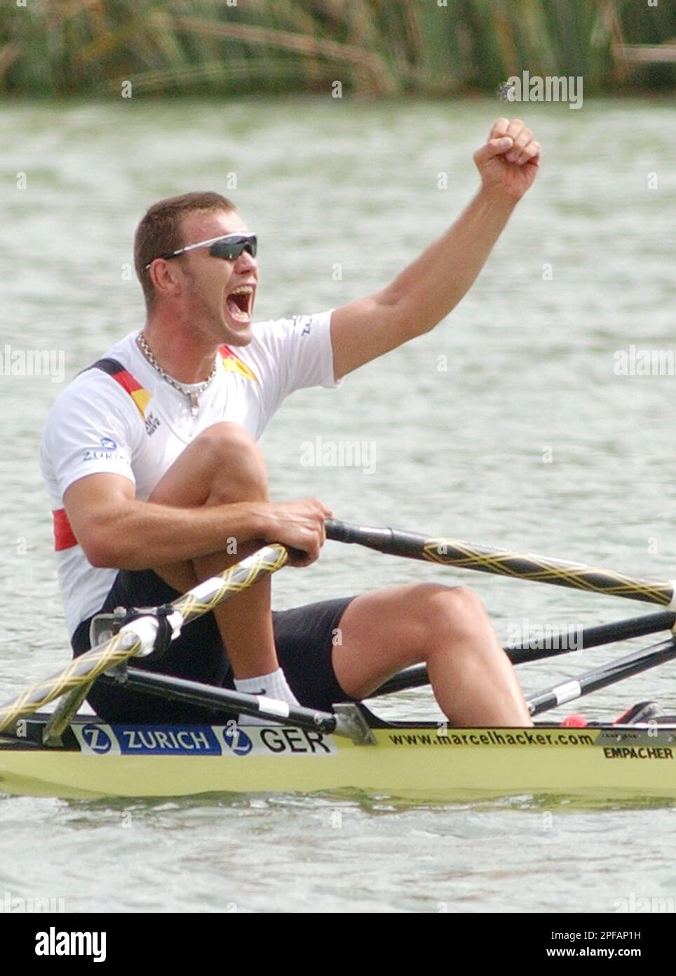Germany's Marcel Hacker reacts after crossing the finish line to take ...