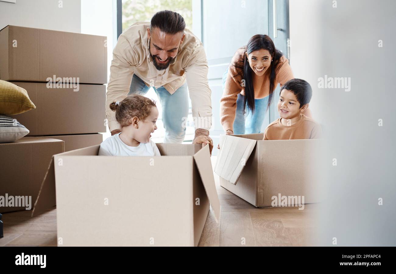 Playful, fun and a family moving into a house, bonding and unpacking ...