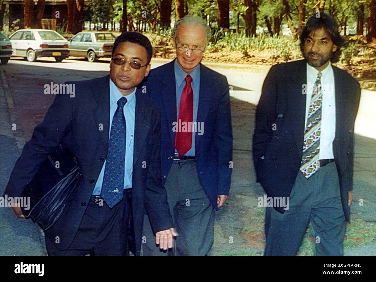 Retired High Court Judge Fergus Blackie, centre, leaves the Magistrates ...