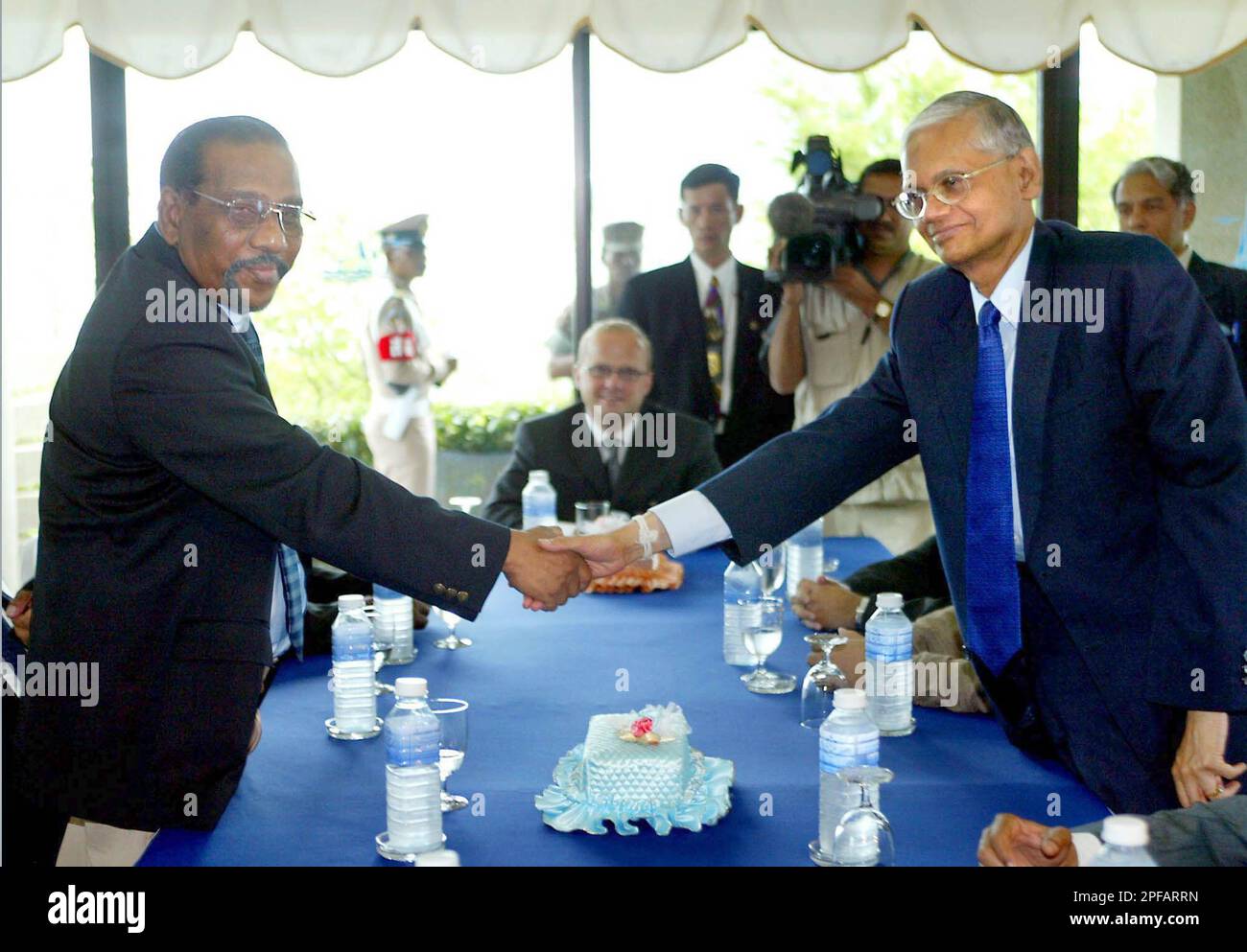 Sri Lanka's Constitutional Affairs Minister G.L. Peiris, right, shakes ...