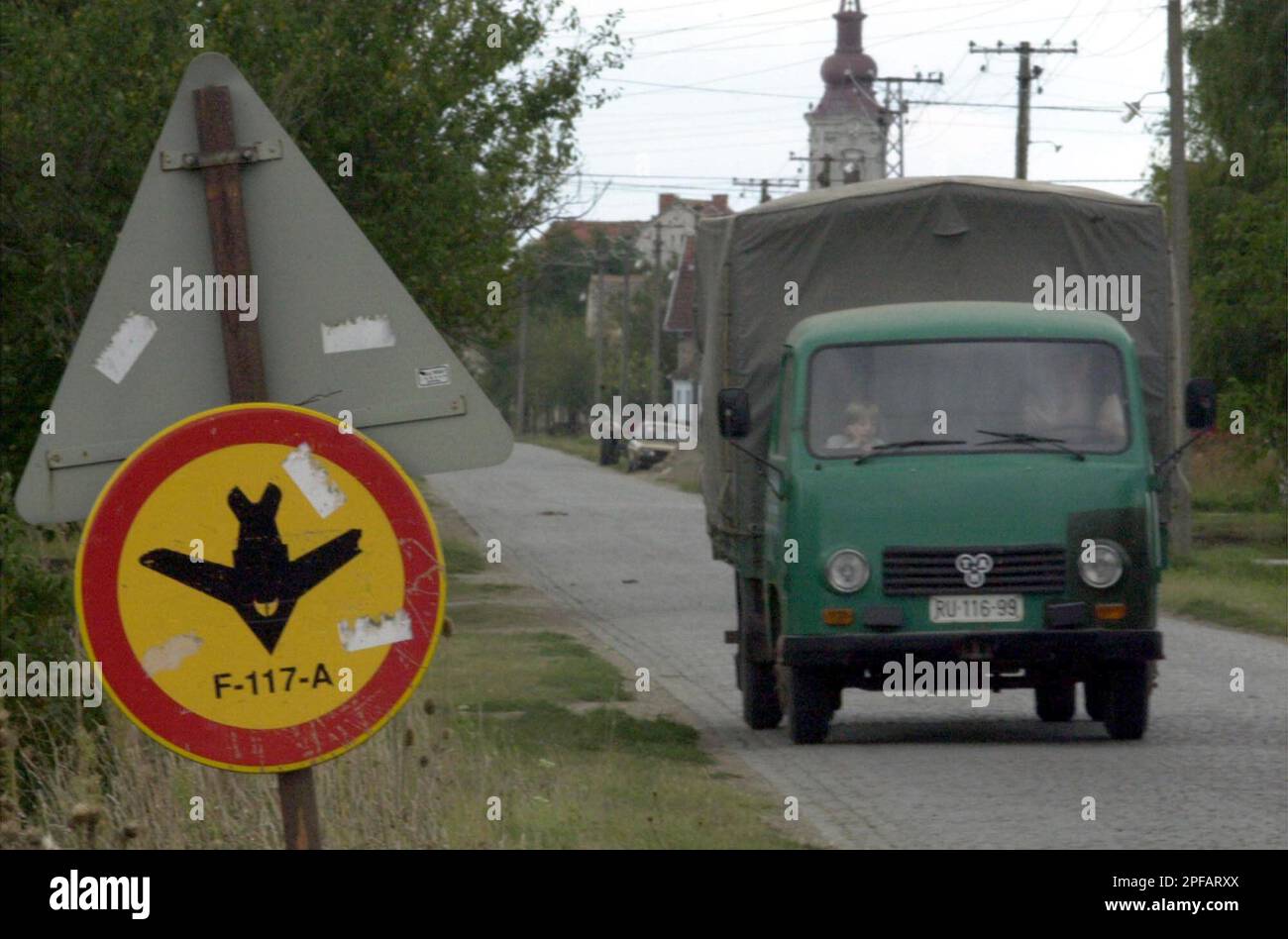 A truck nears a mock traffic sign banning U.S. STEALTH F-117 planes ...