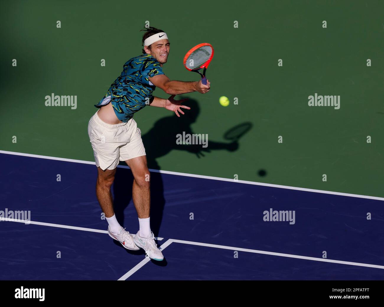 March 16, 2023 Taylor Fritz returns a shot against Jannik Sinner of Italy during the 2023 BNP ...