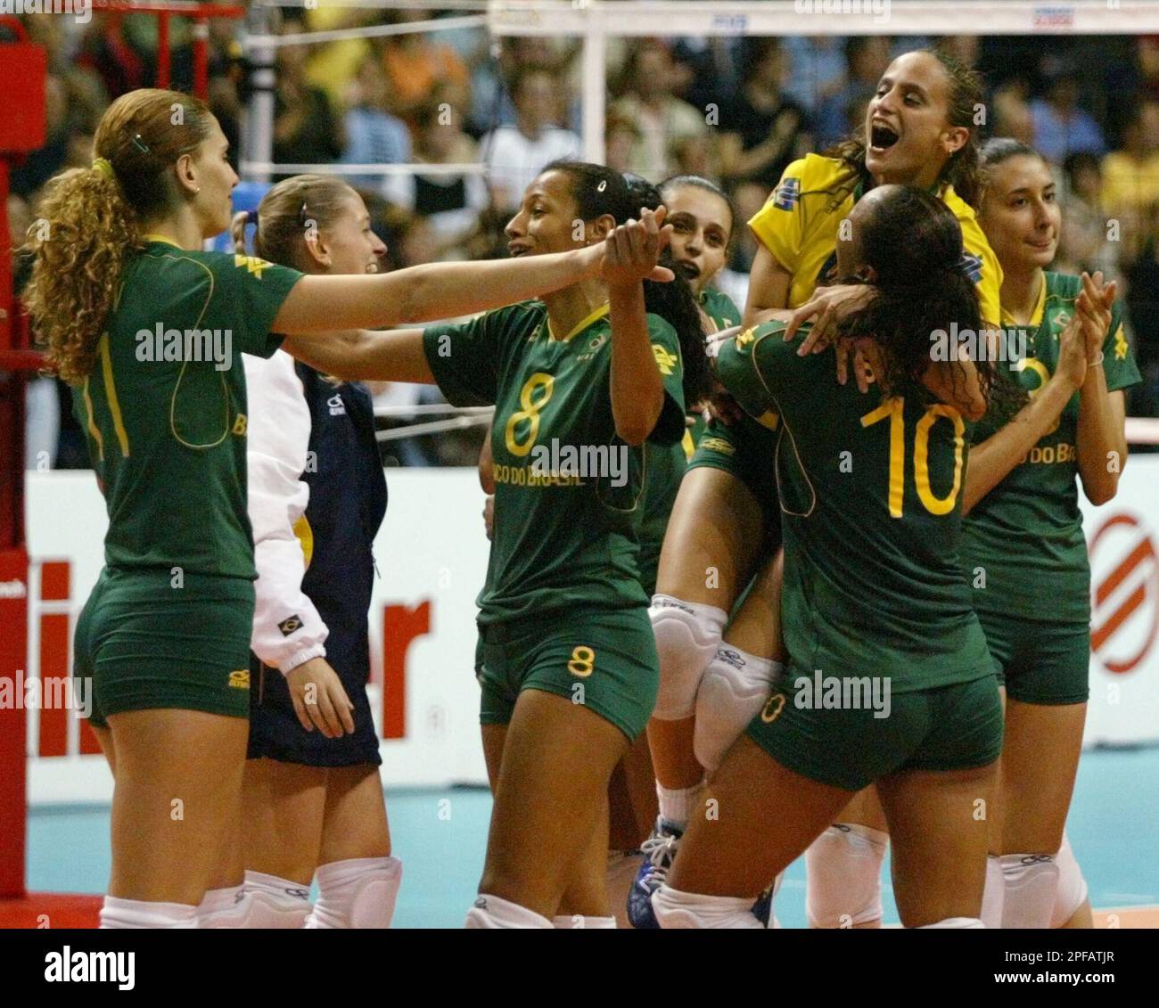 Brazil's volleyball team celebrates after their final match vs ...