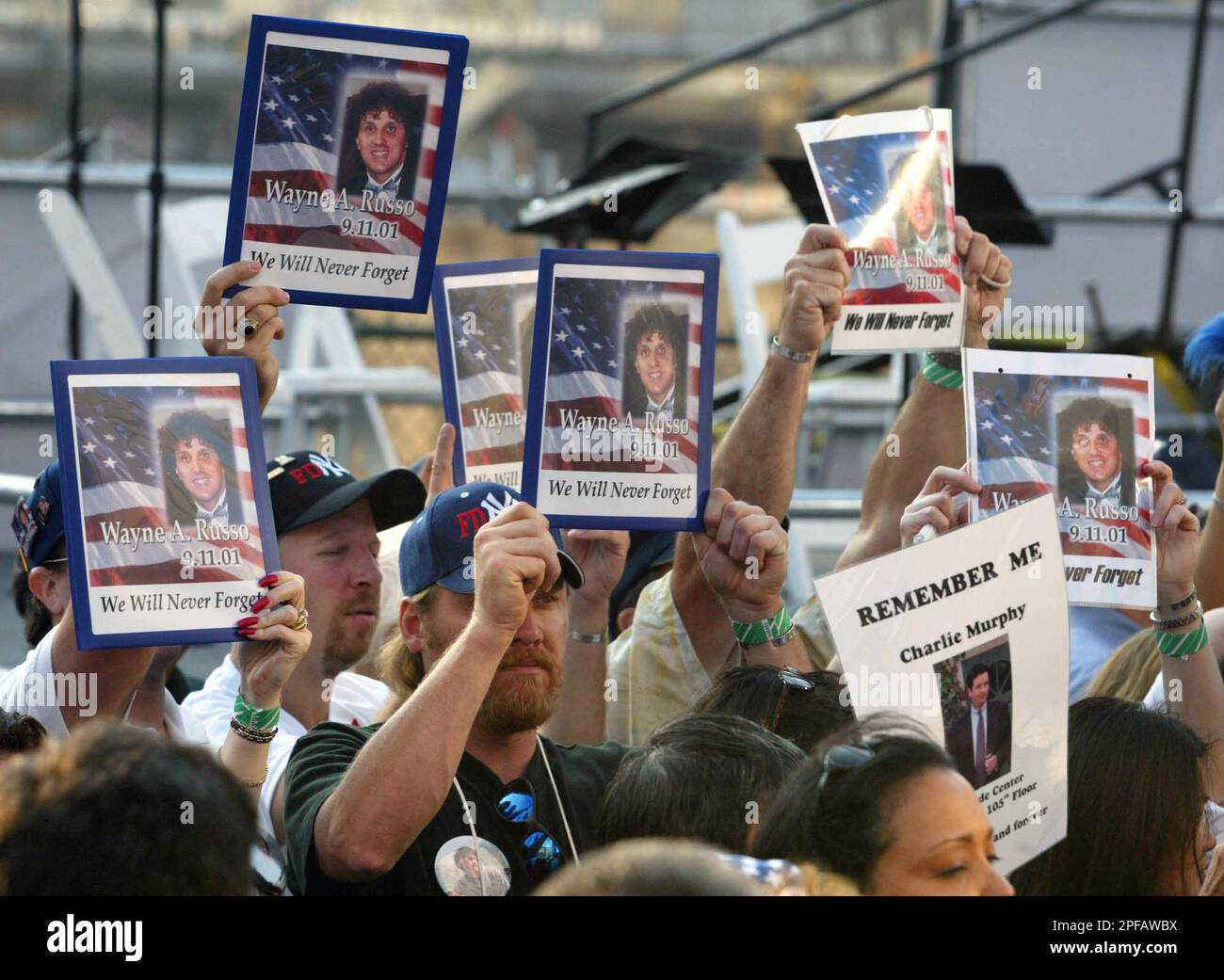 Friends and relatives of Wayne A. Russo and Charlie Murphy, two victims ...