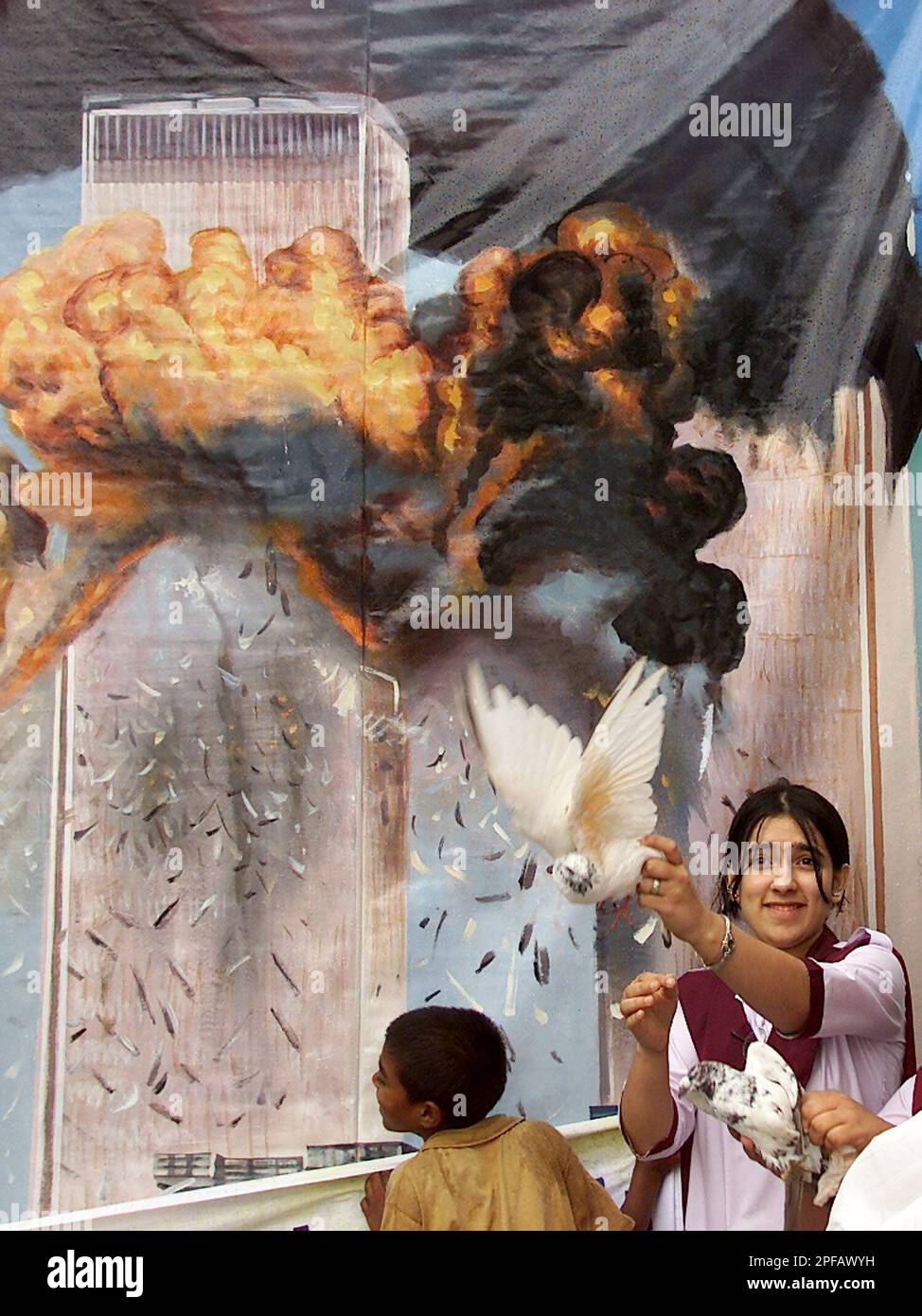 A member of Pakistani Christian community releases dove to wish peace ...