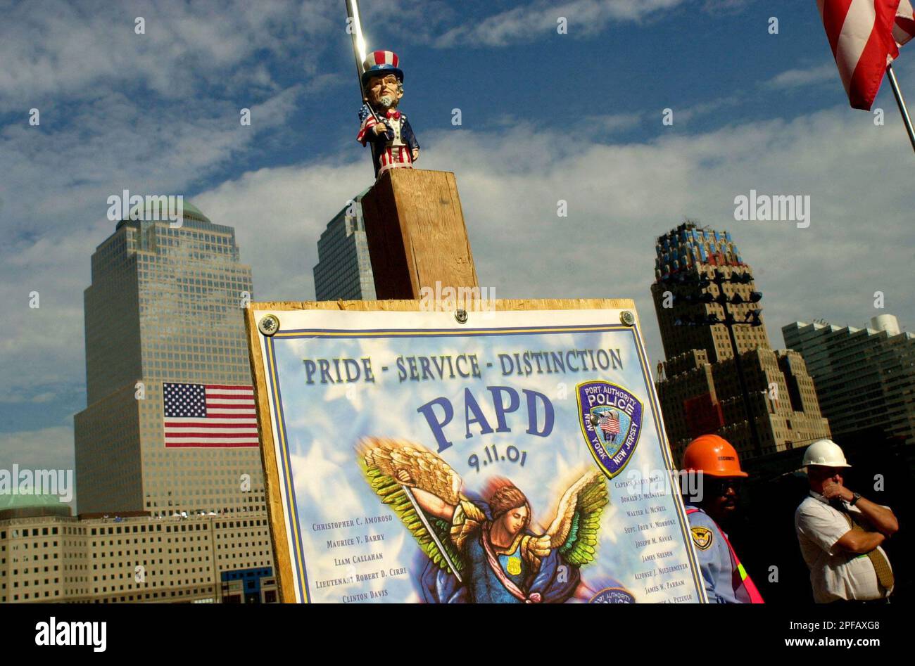 A Port Authority Police Department poster stands next to ground zero in ...