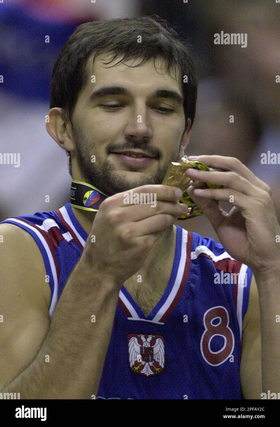 Yugoslovia's Predrag Stojakovic examines his gold medal during medal ...