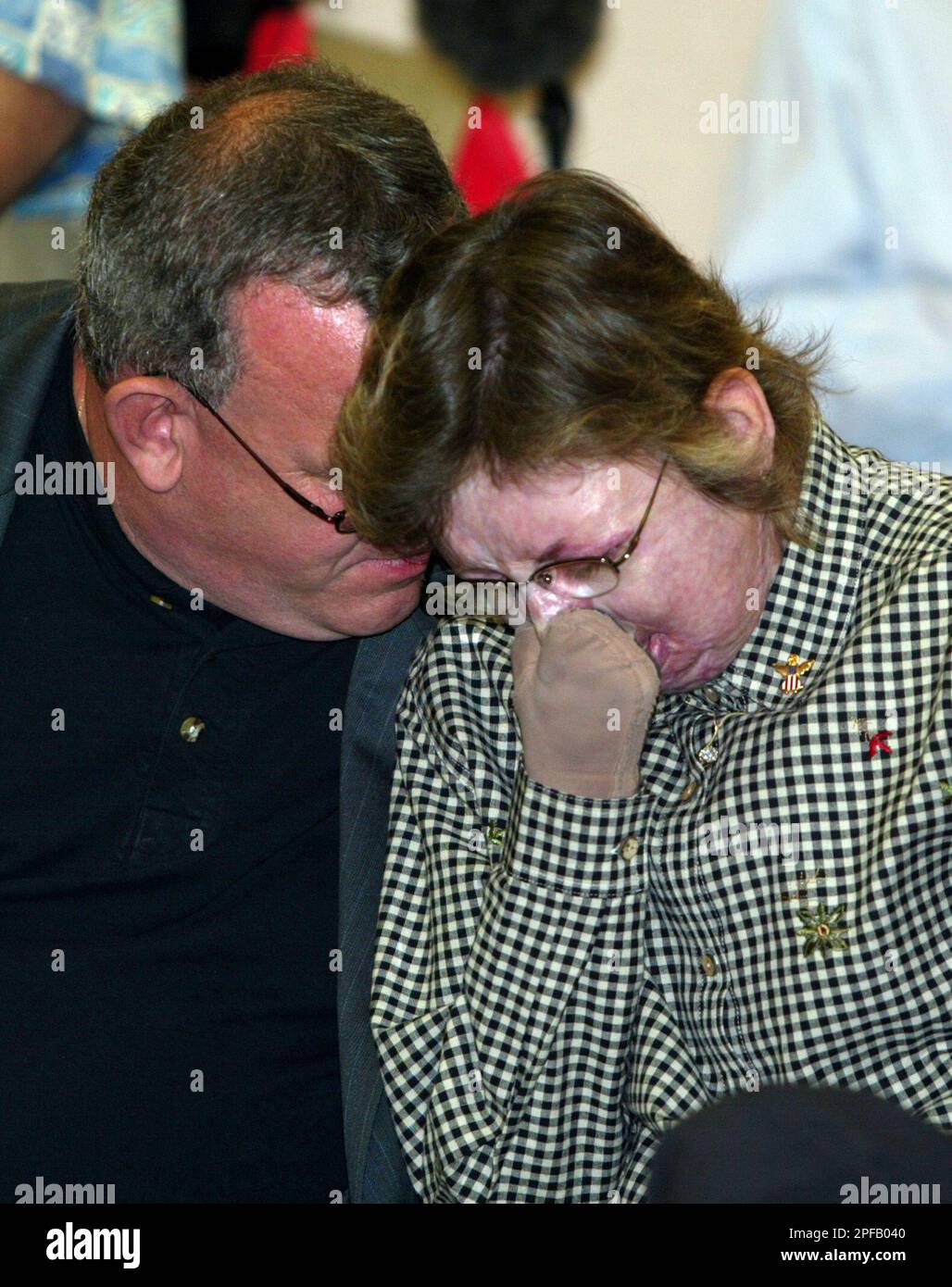 Pentagon attack survivor Louise Ann Kurtz, right, is comforted by her ...