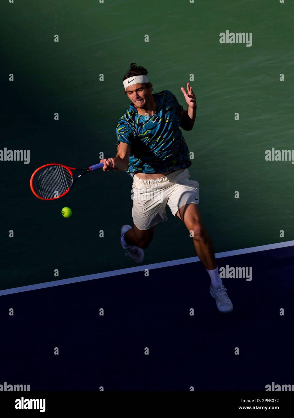 March 16, 2023 Taylor Fritz returns a shot against Jannik Sinner of Italy during the 2023 BNP ...
