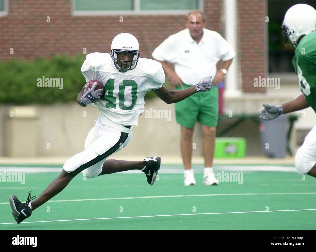 Marshall wide receiver Darius Watts (40) runs the ball to the outside ...