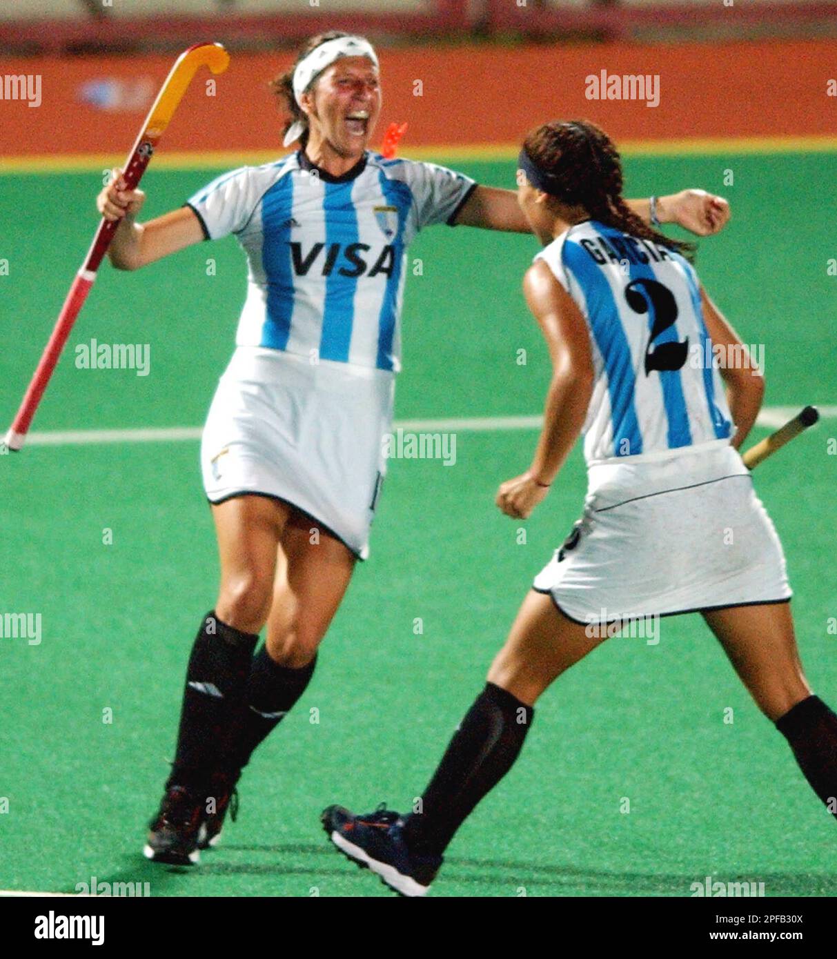 Argentina's Karina Masotta, left, celebrates with her teamate after ...