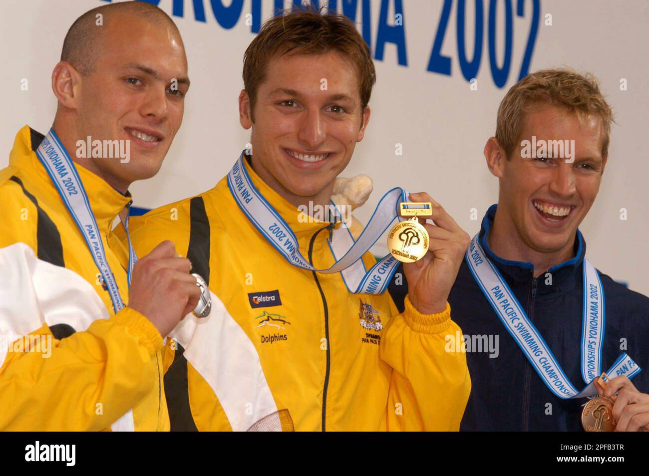 Men's 100-meter freestyle gold medalist Ian Thorpe of Australia and his ...