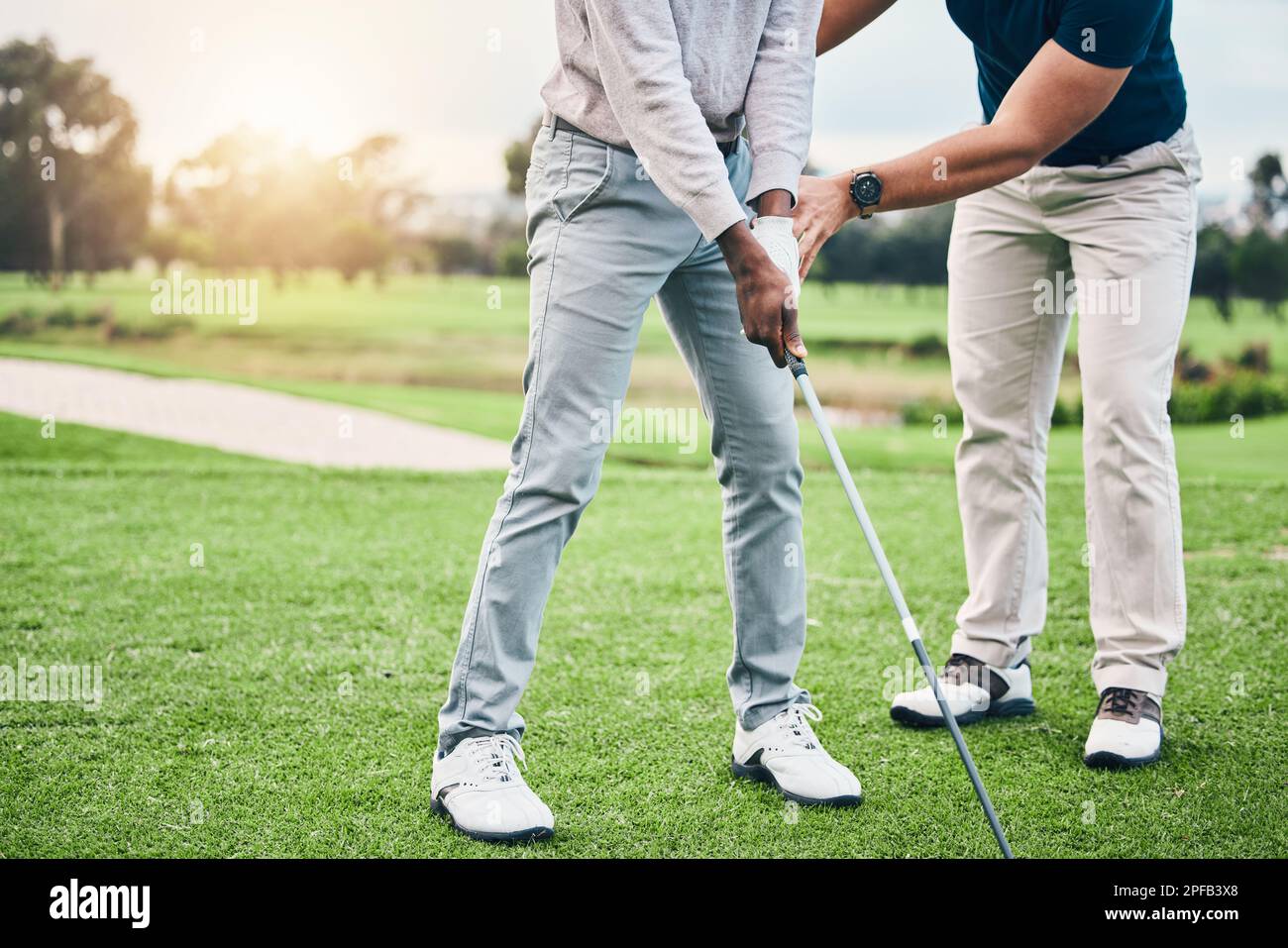 Golf lesson, sports teaching and coach hands helping a man with swing ...