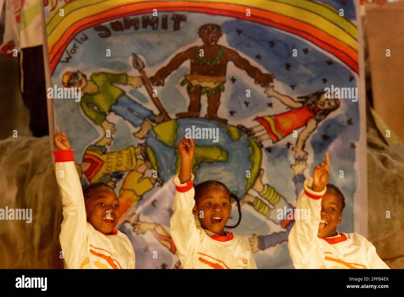 Children sing a song during the welcoming ceremony of the World Summit ...