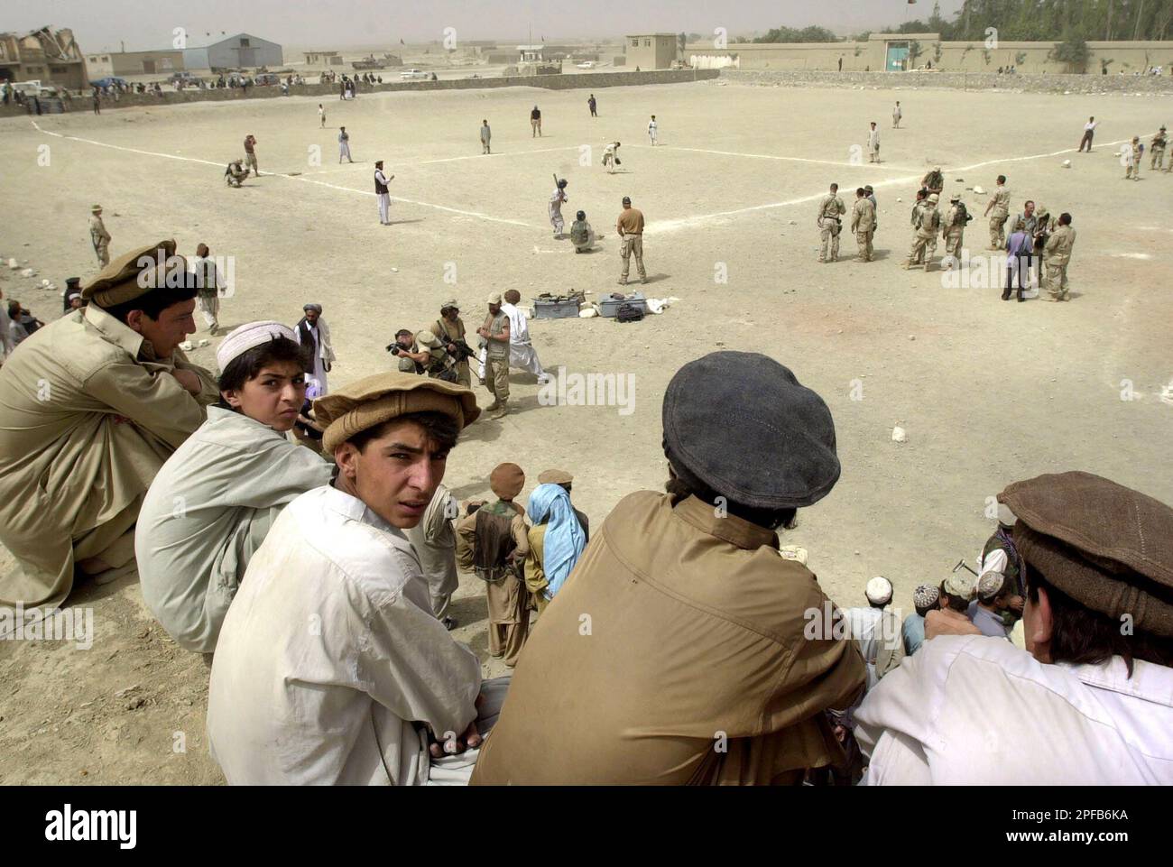 Local Afghans watch a Little League baseball game of the Afghan Club vs ...