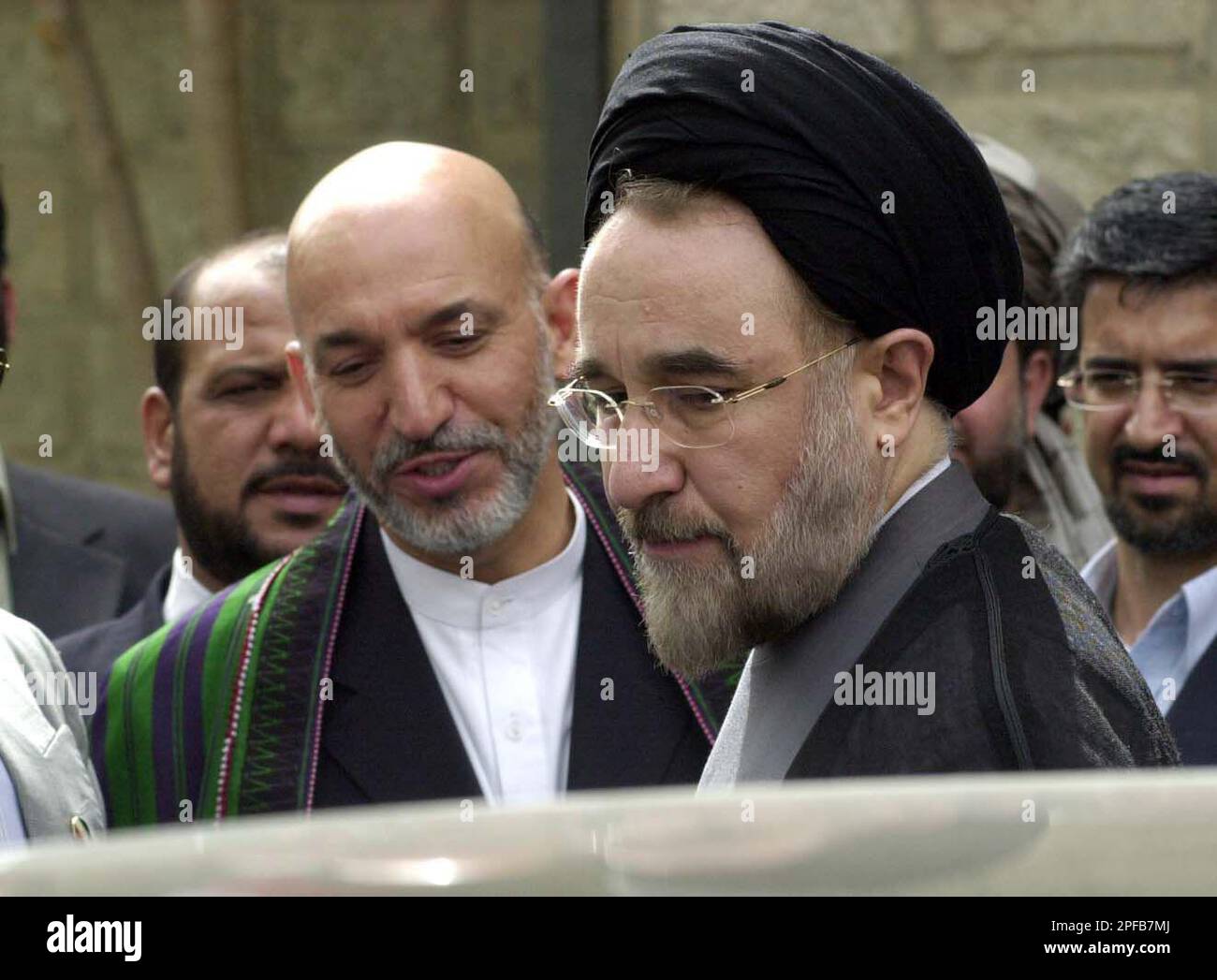 Iranian President Mohammad Khatami, right, gets into a car as Afghan ...