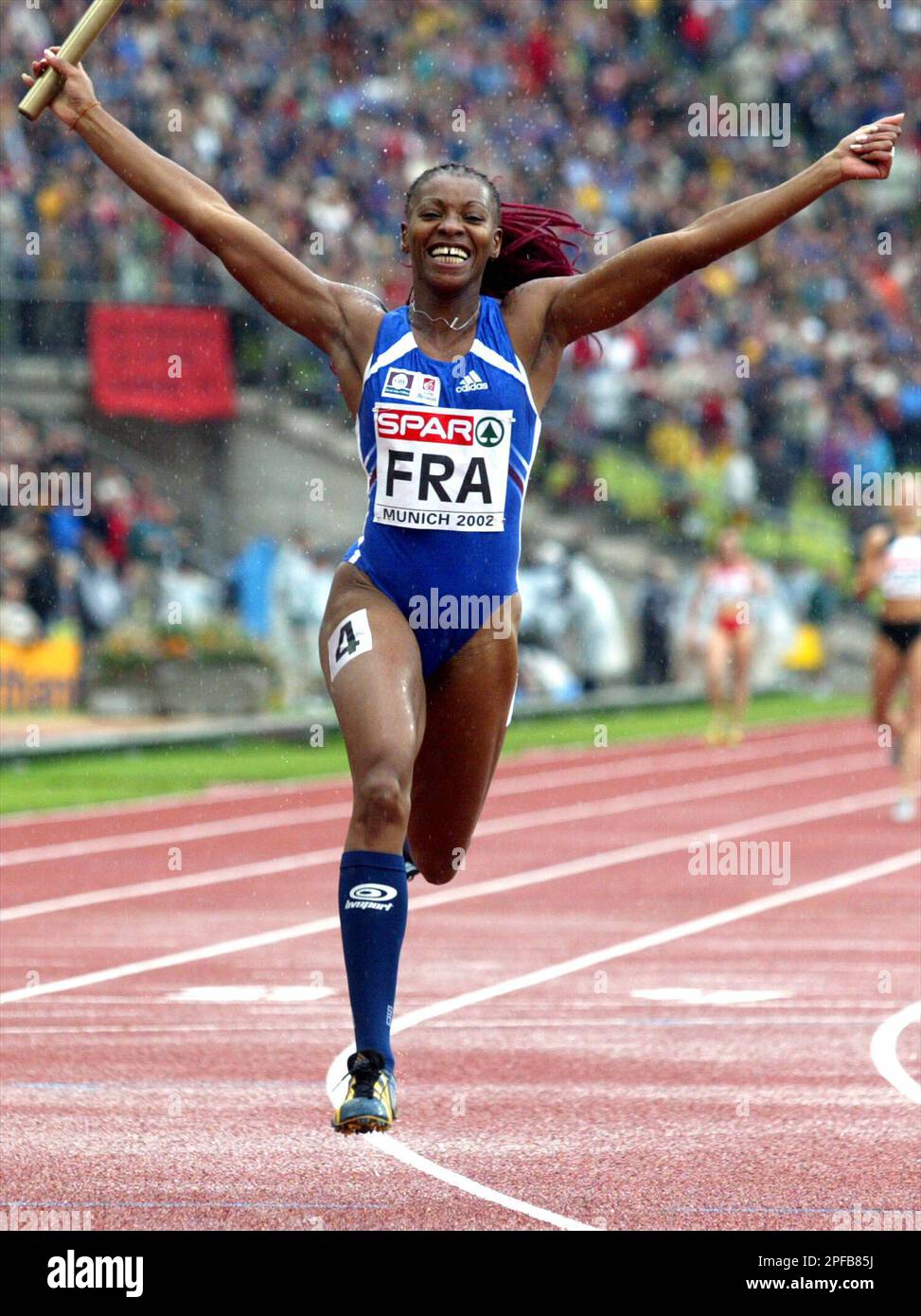 France's Odiah Sidibe crosses the finish line to help her team win the ...