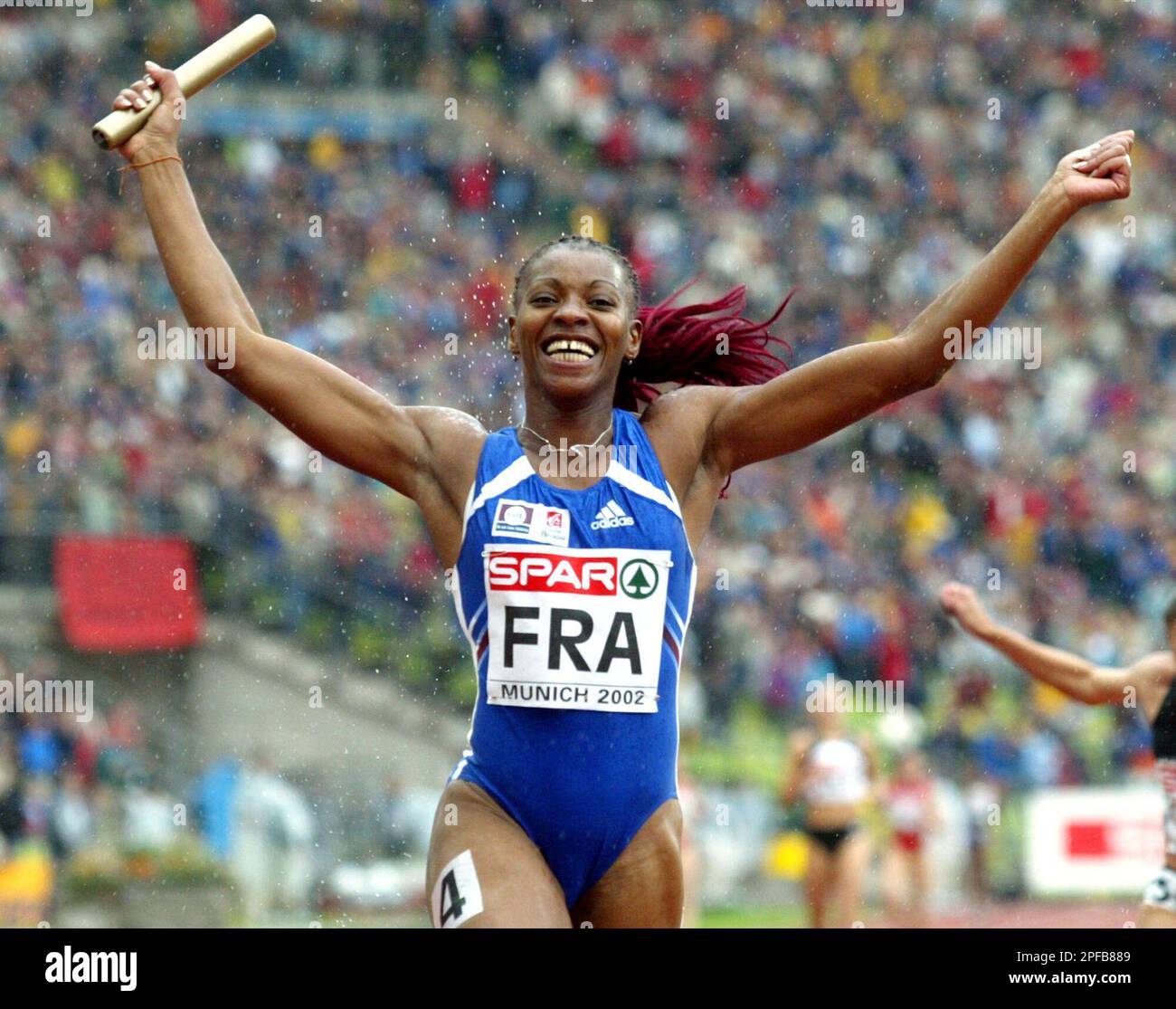 France's Odiah Sidibe crosses the finish line to help her team win the ...