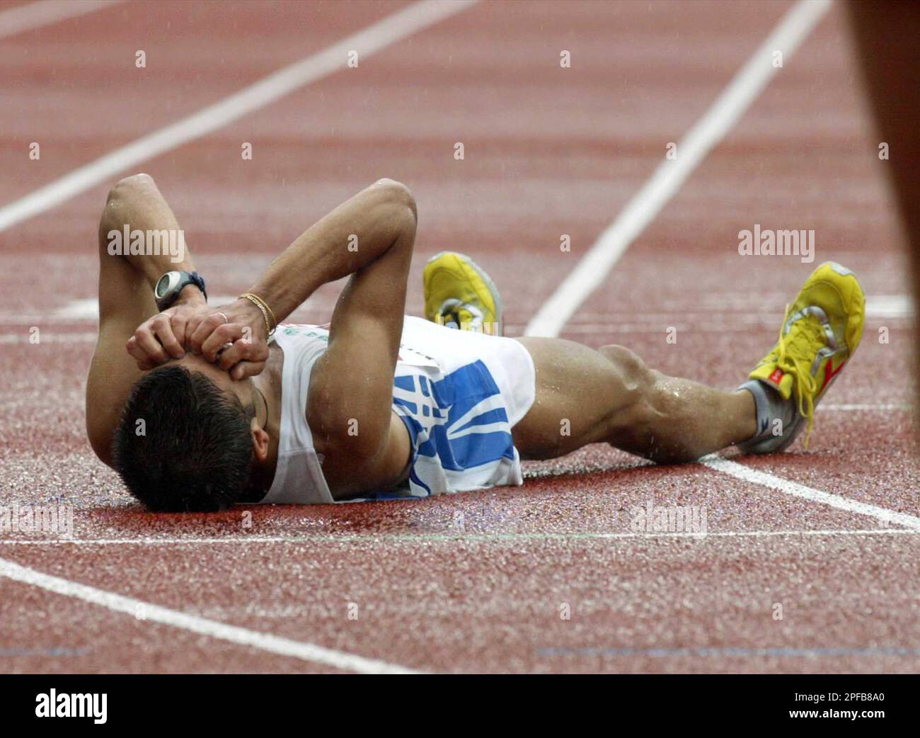 Italy's Daniele Caimmi lies crying on the ground after finishing fourth ...