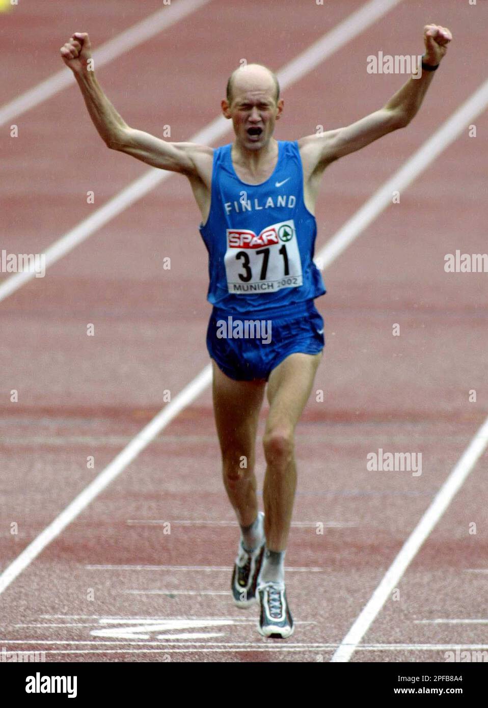 Finland's Janne Holmen crosses the finish line to capture victory in ...