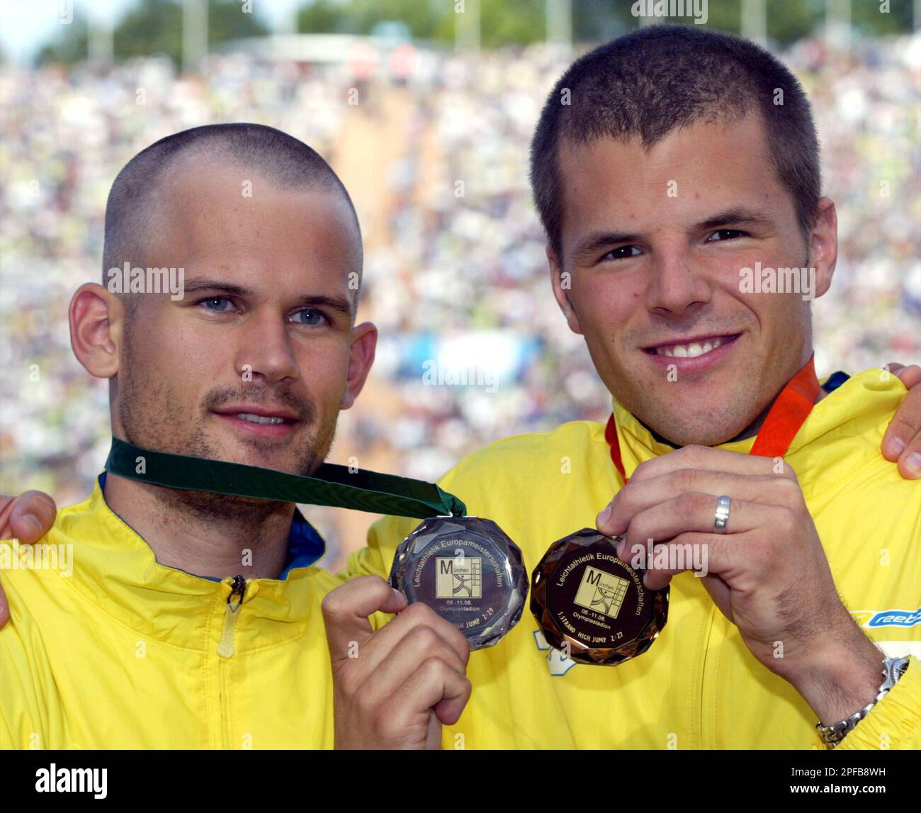 Silver medal winner Stefan Holm, left, and bronze medal winner Staffan ...