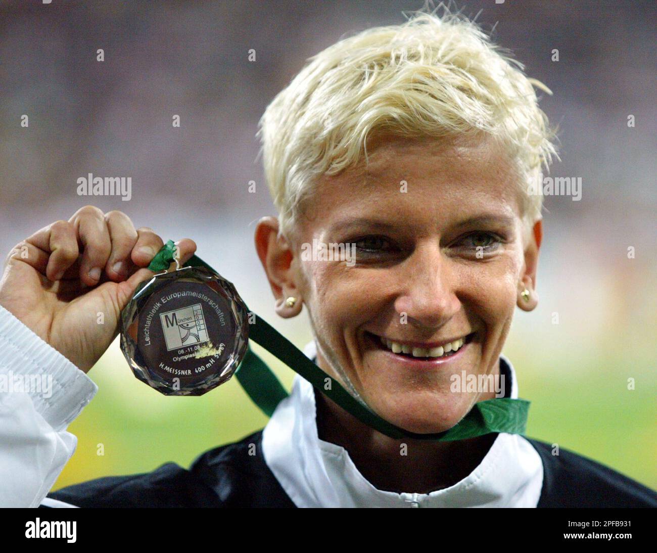 German Heike Meissner displays her silver medal she won in the 400 m ...