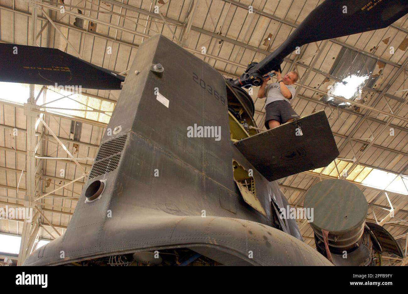 U.S. Army Pvt. 1st Class Eric Wehmeyer of Belton, Missouri, works on ...