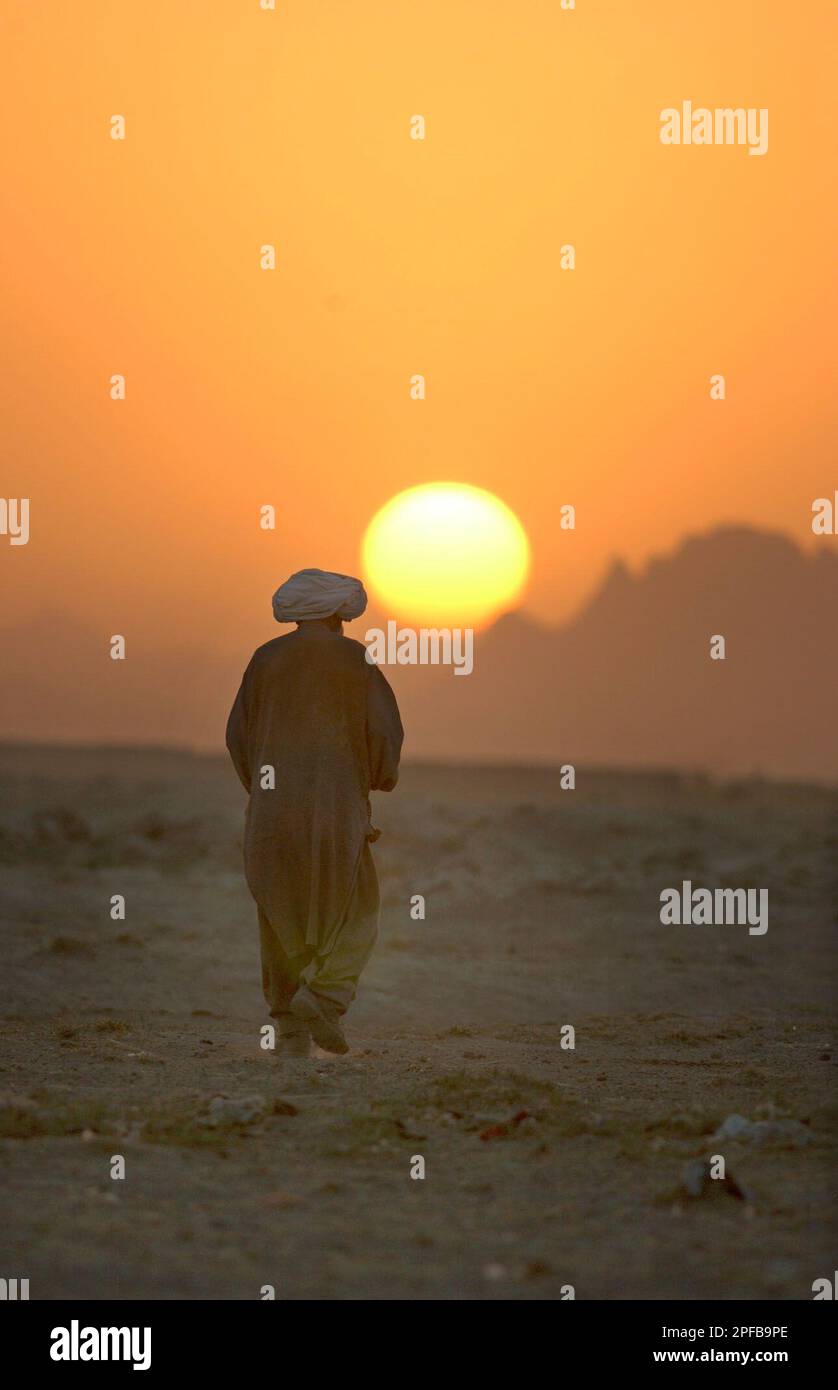 ** SIX OF SIX PHOTOS ON KUCHI NOMADS ** A Kuchi man head towards the ...