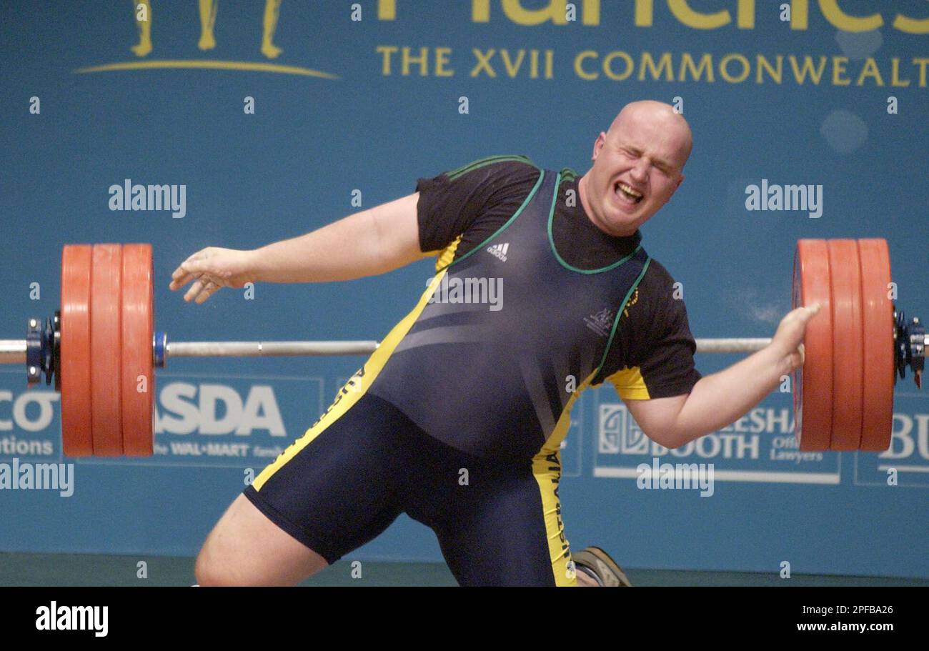 Australia's Chris Rae drops the weights while attempting a snatch lift ...