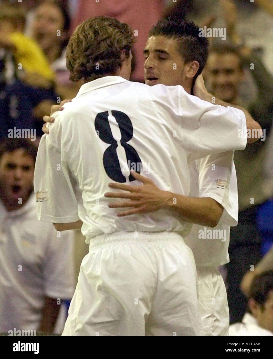Real Madrid's Javier Garcia Portillo, right is hugged by English team ...