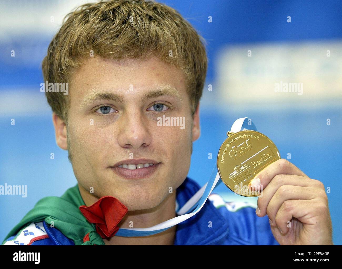 Italian diver Nicola Marconi presents his gold medal after the winner's ...
