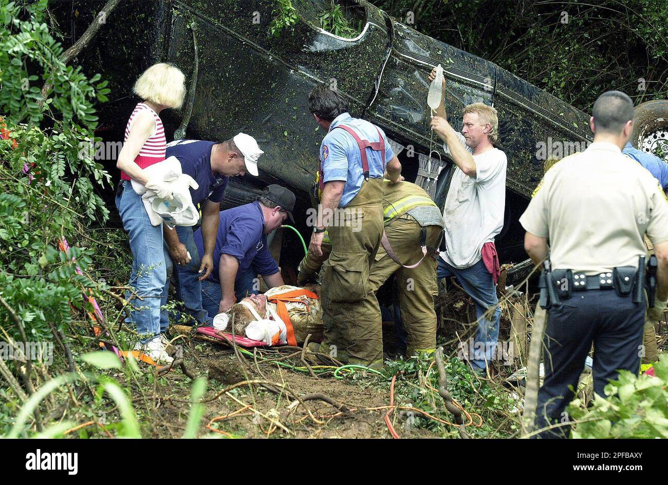 Rescue personnel remove Ronald Keys, 51, of Center, Texas, from the ...