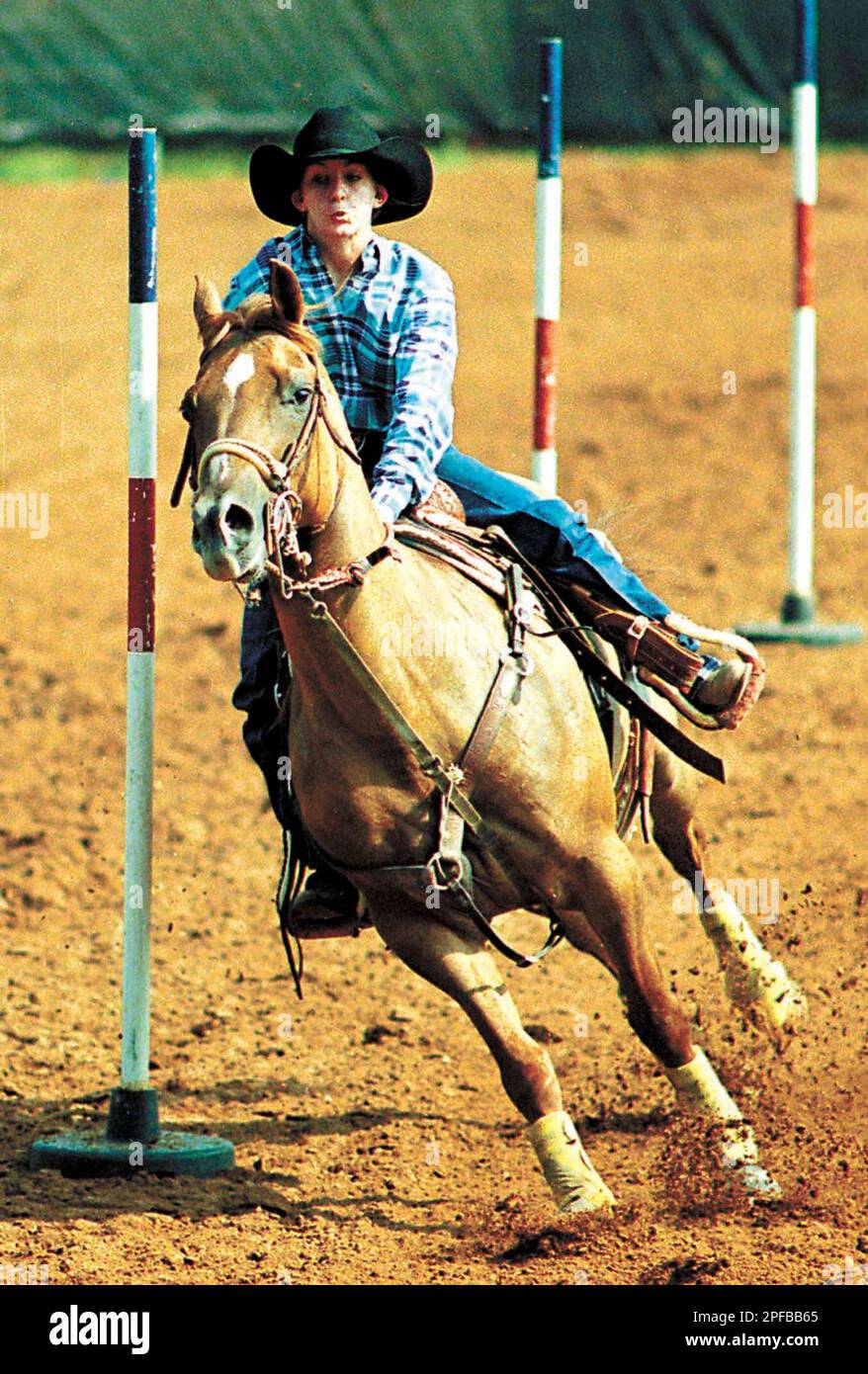 Angleton, Texas, cowgirl Angie Bennett weaves the poles Tuesday, July 9 ...
