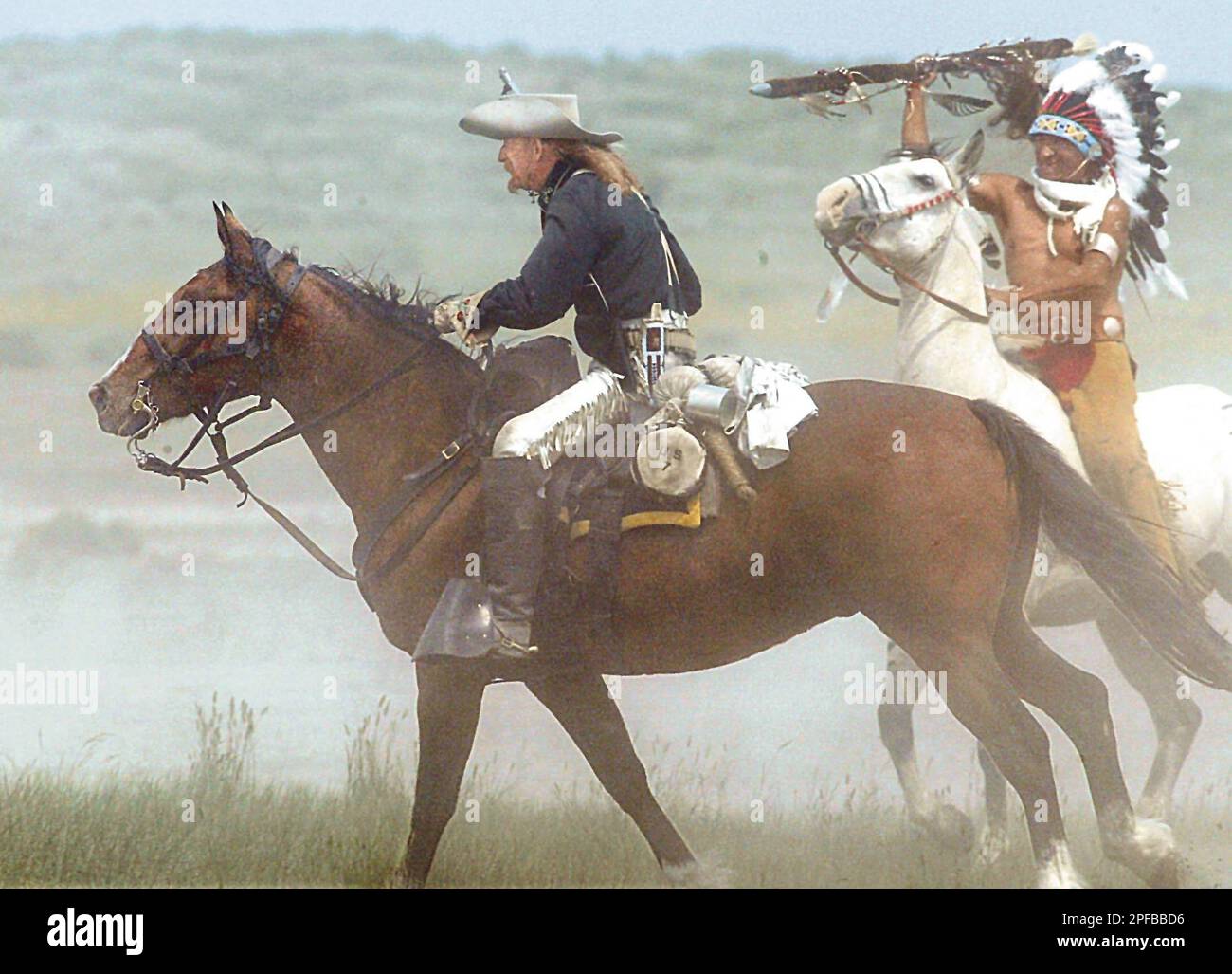 An American Indian warrior chases General George Custer, played by Tony ...