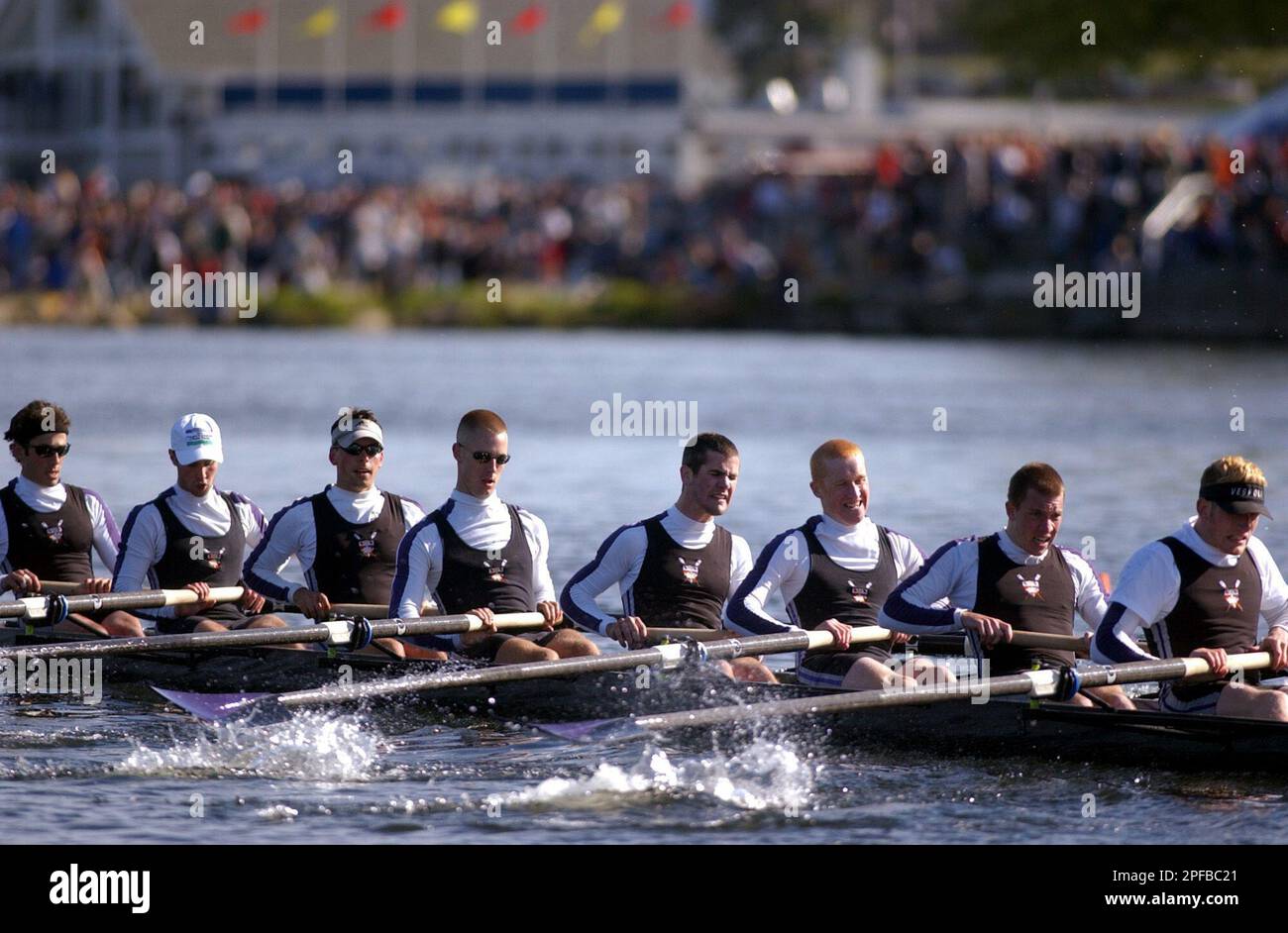 The Holy Cross varsity lightweight-8 crew approaches the finish line in ...